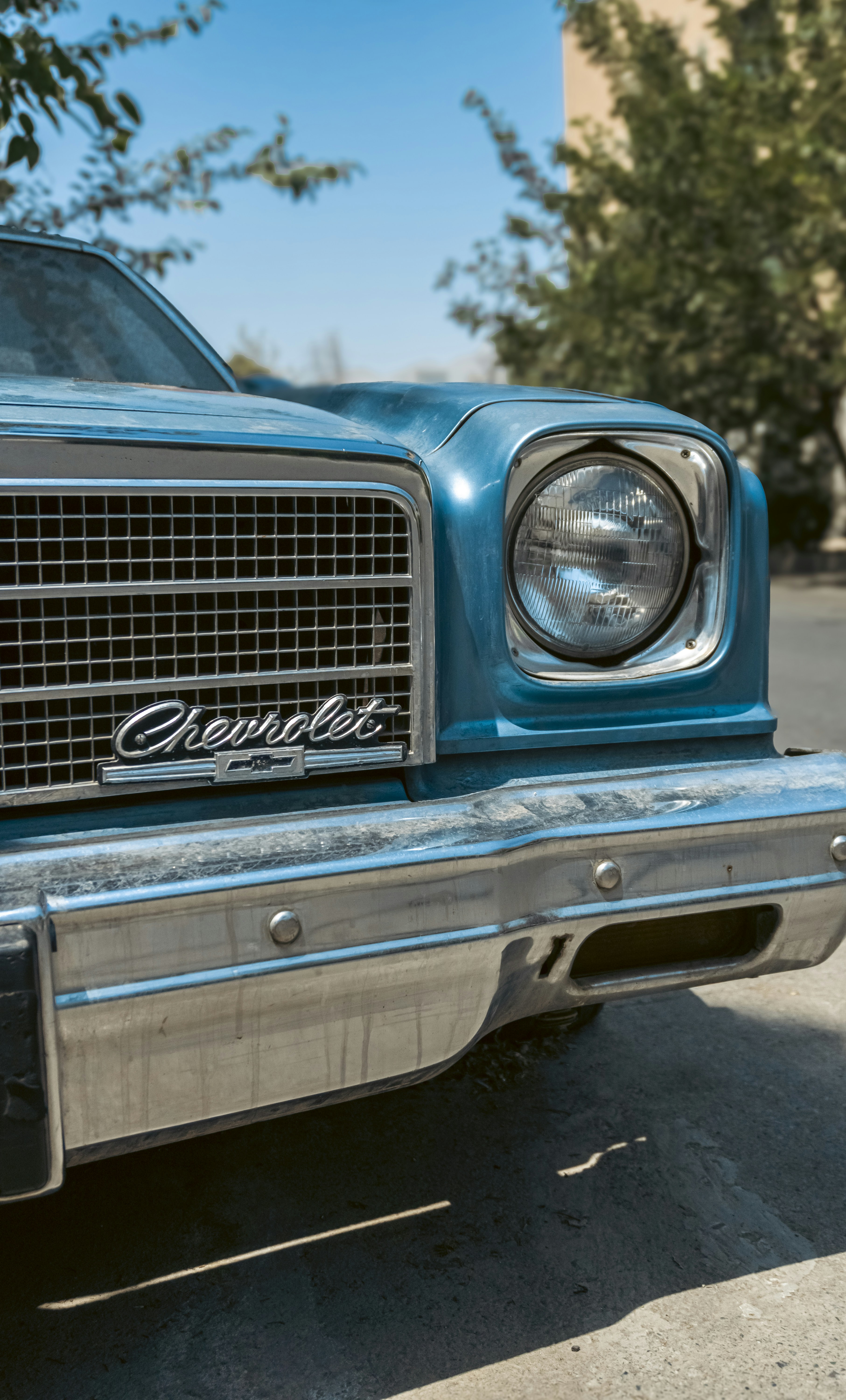 Blue Chrome: Front-Quarter Glimpse of a Classic Chevrolet