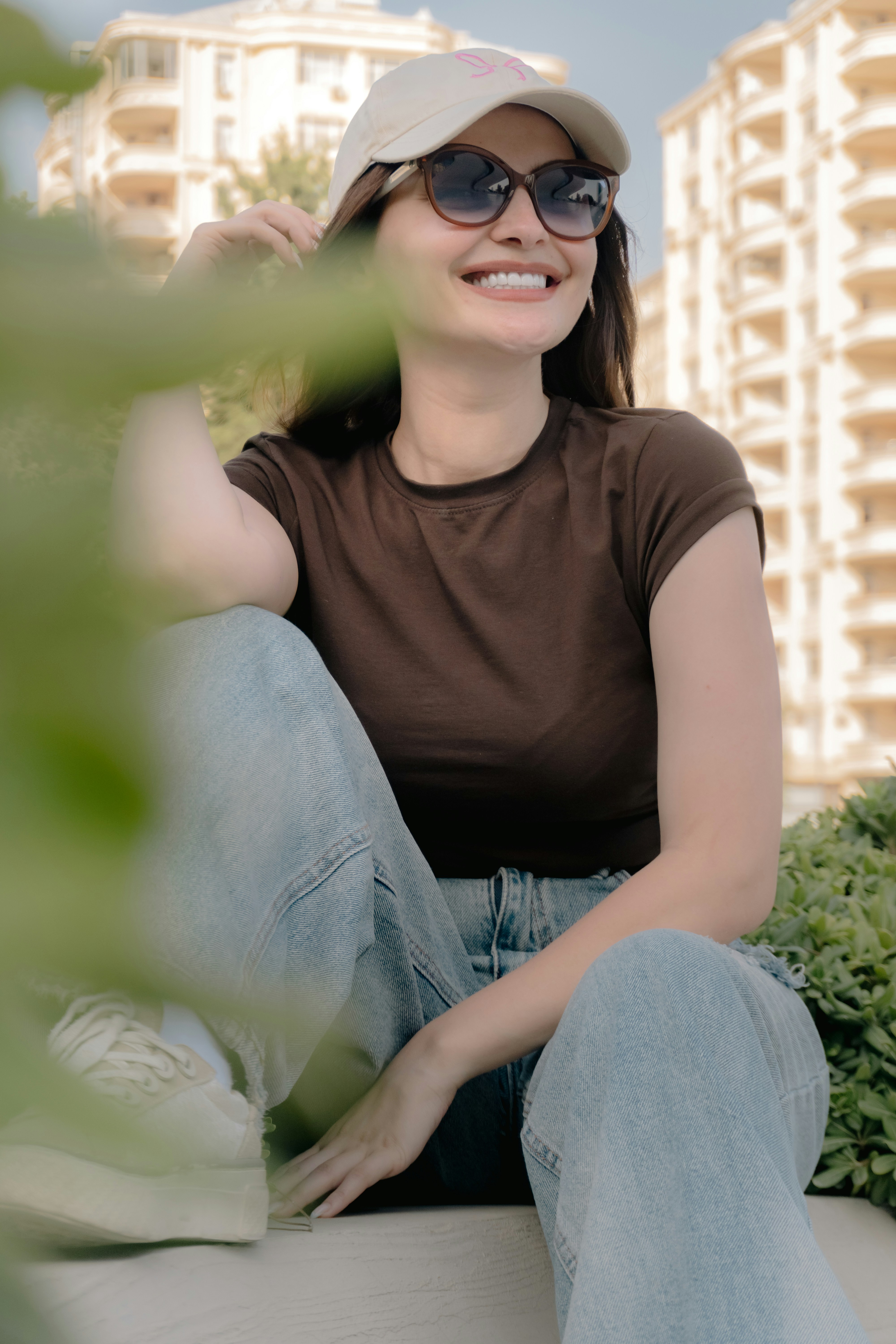 Smiling in the Sun: Casual Portrait on a Modern Terrace
