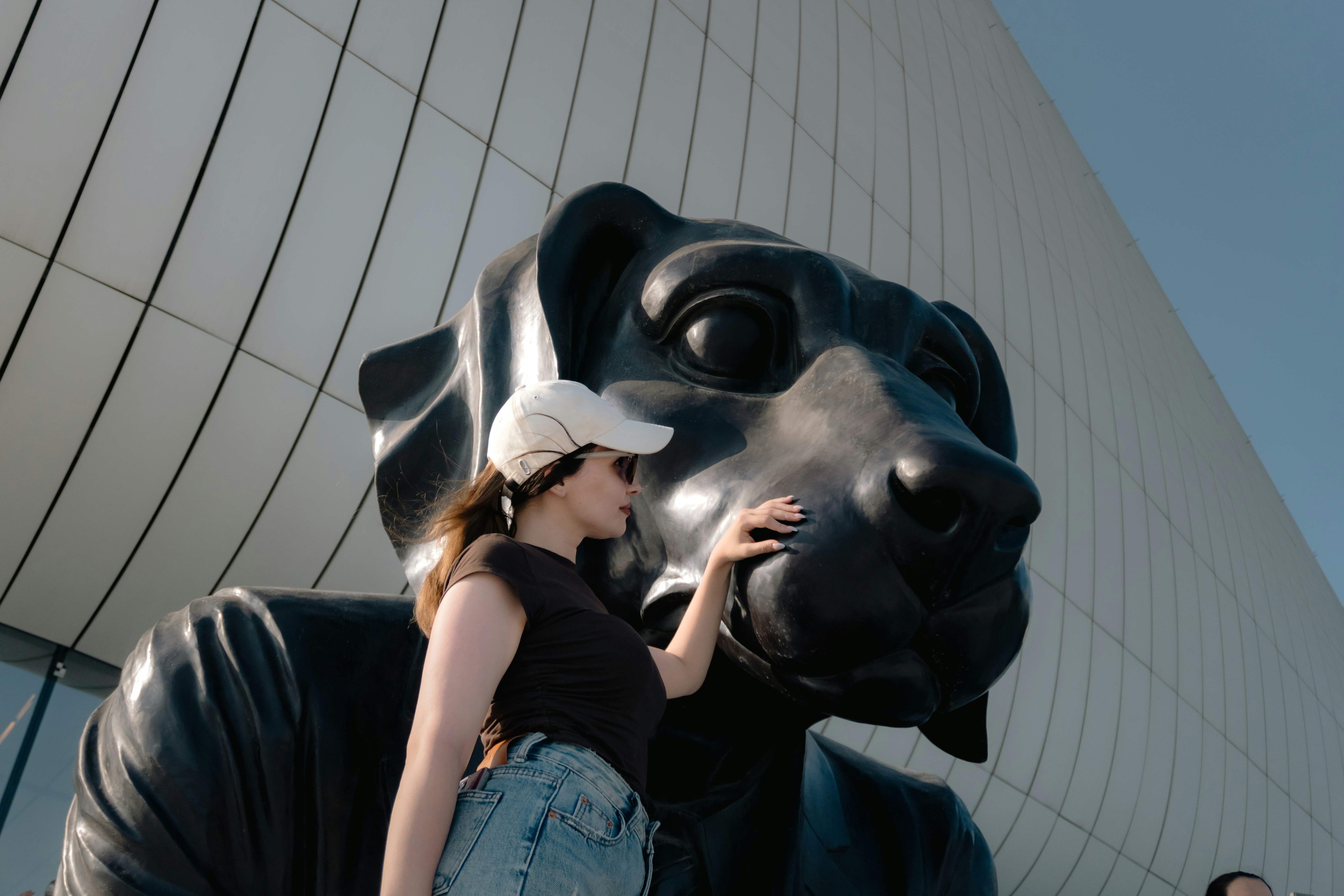 Touching the Giant Head: A Portrait by the Museum Lawn
