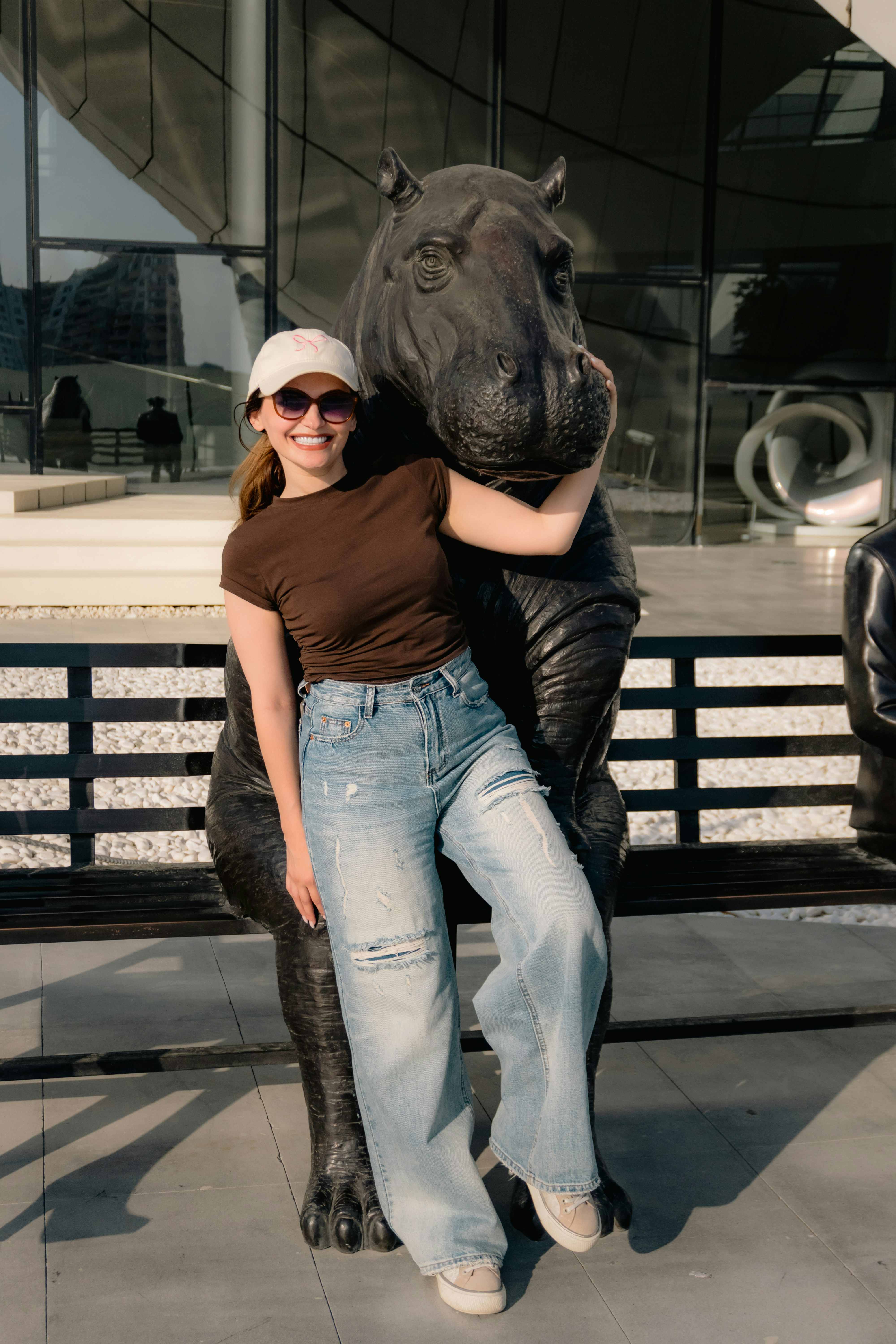 Smiles and Sculpture: A Sunny Moment with a Life-Sized Friend