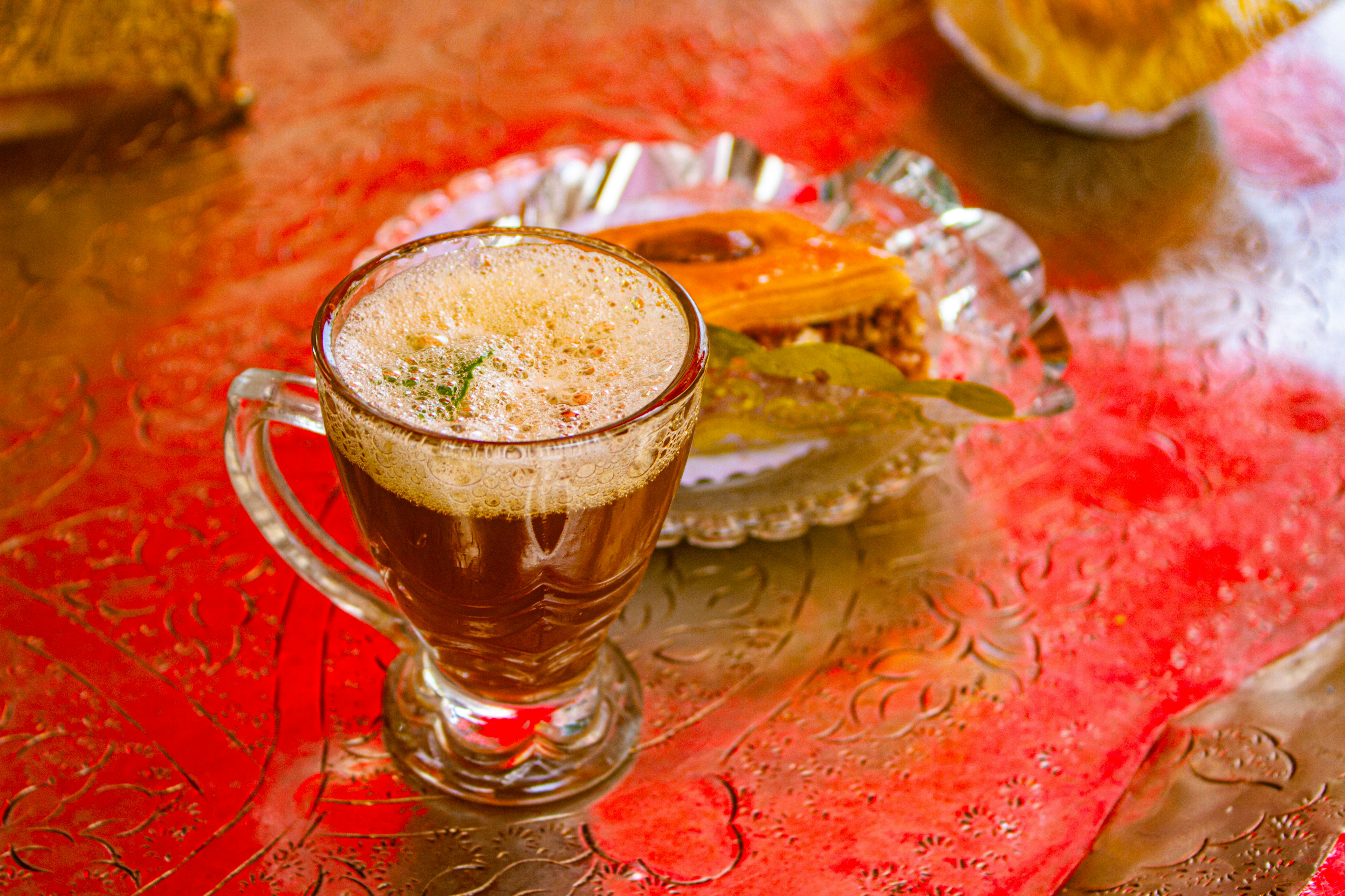 Foamy Coffee Glow on a Rich Red Table