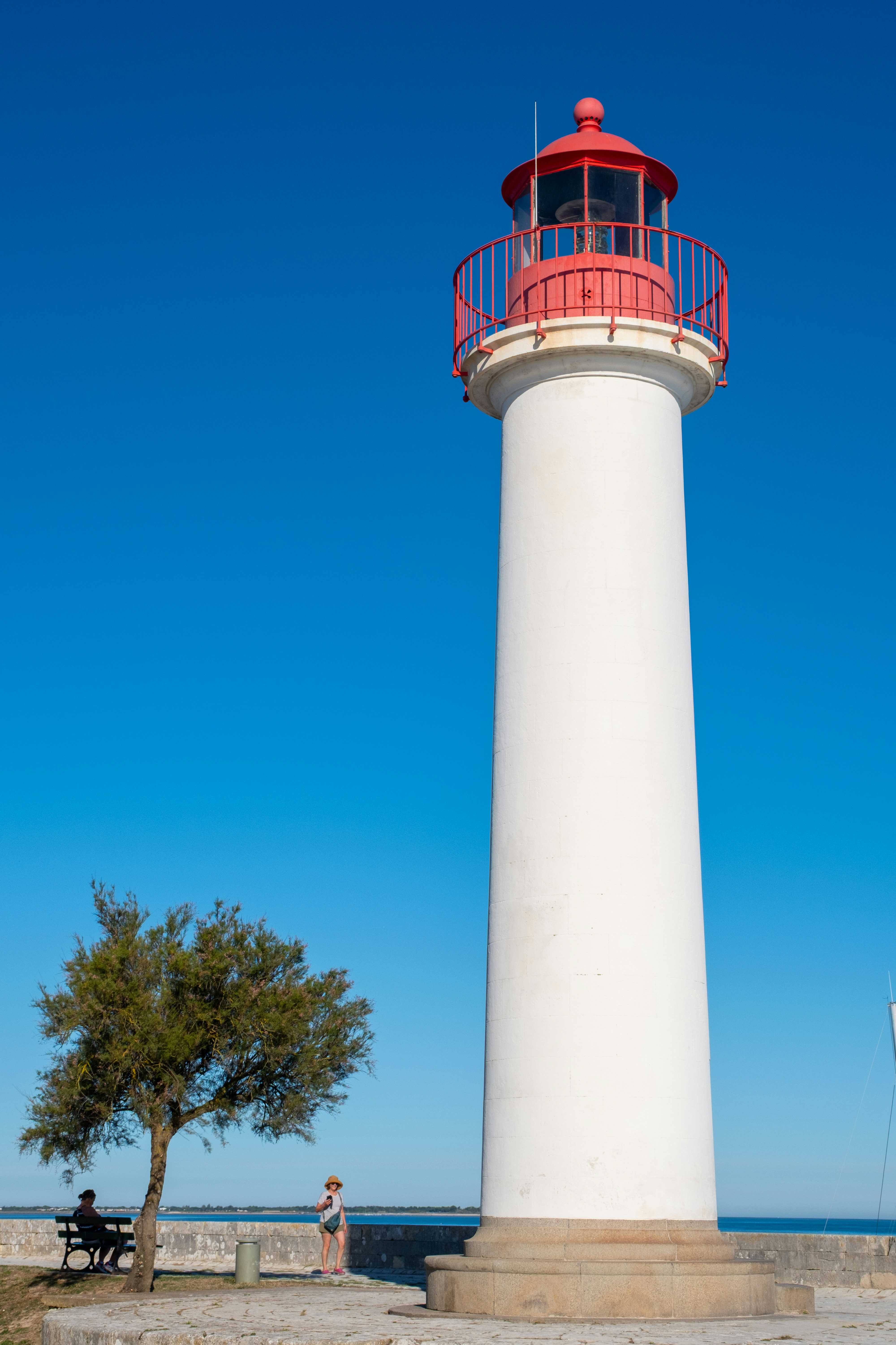 Red-Capped Beacon over a Calm Sea