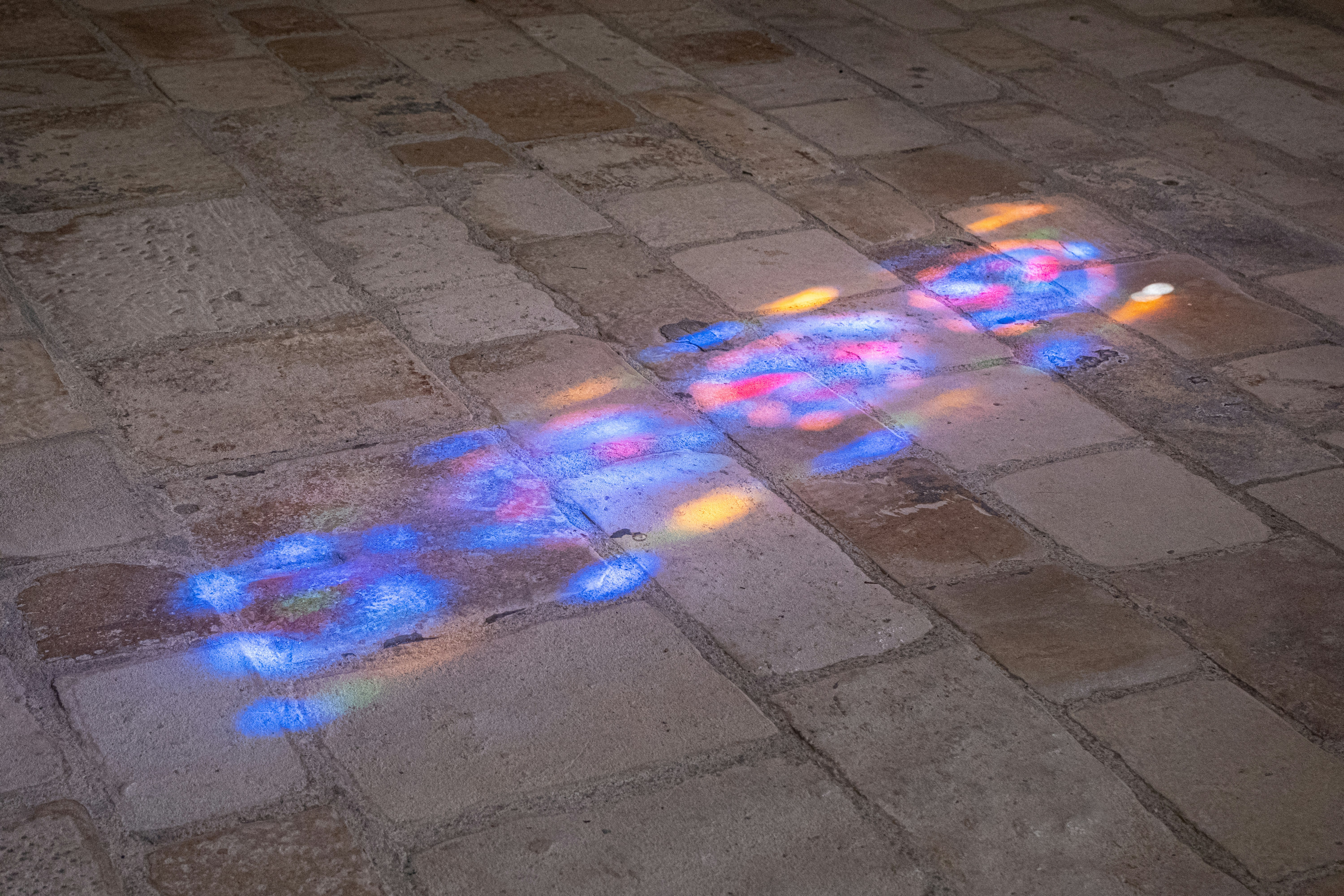 Iridescent Footpath: A Ribbon of Neon on Stone