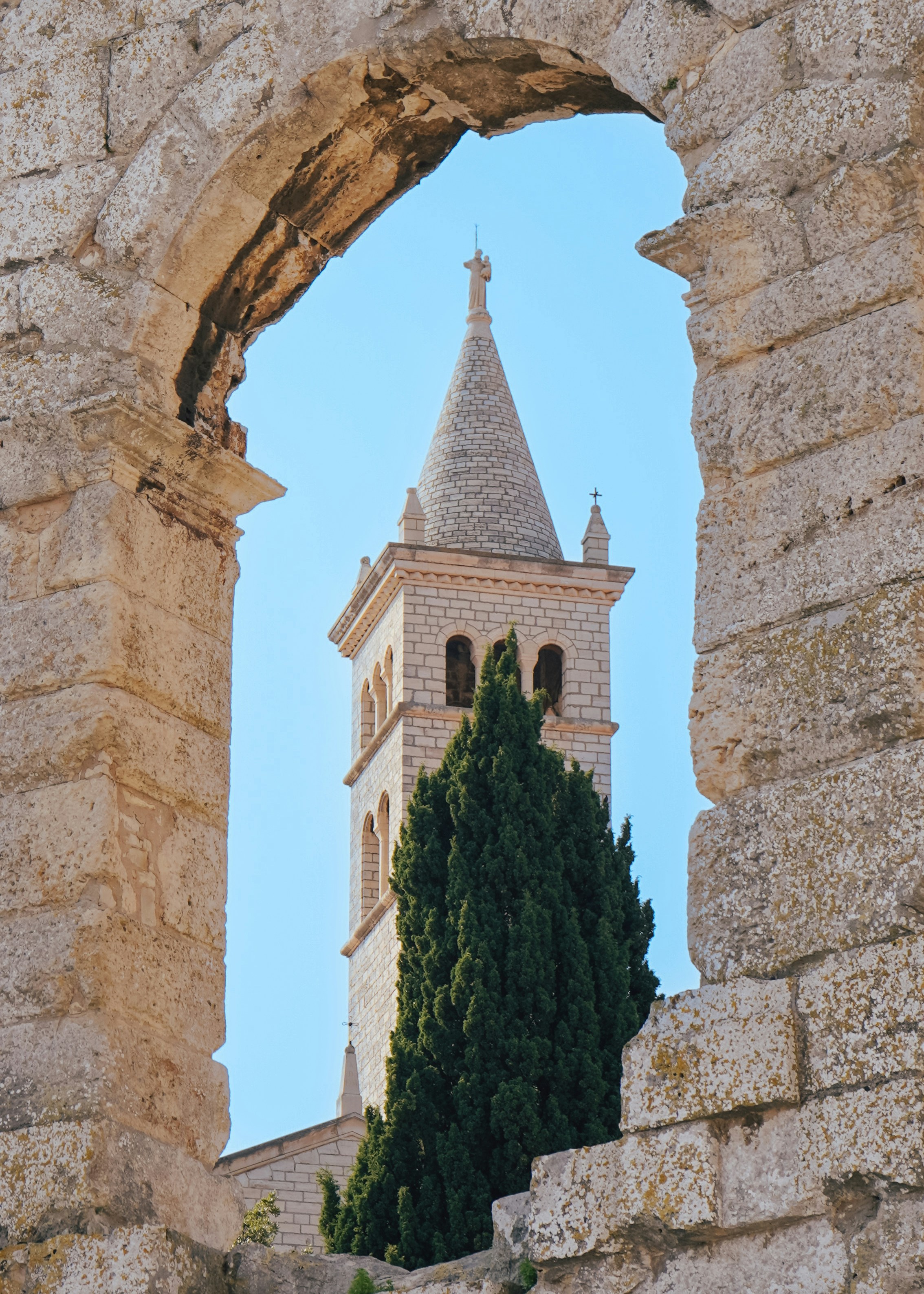 Stone Archway Framing a Tower: Silence Behind the Ruins