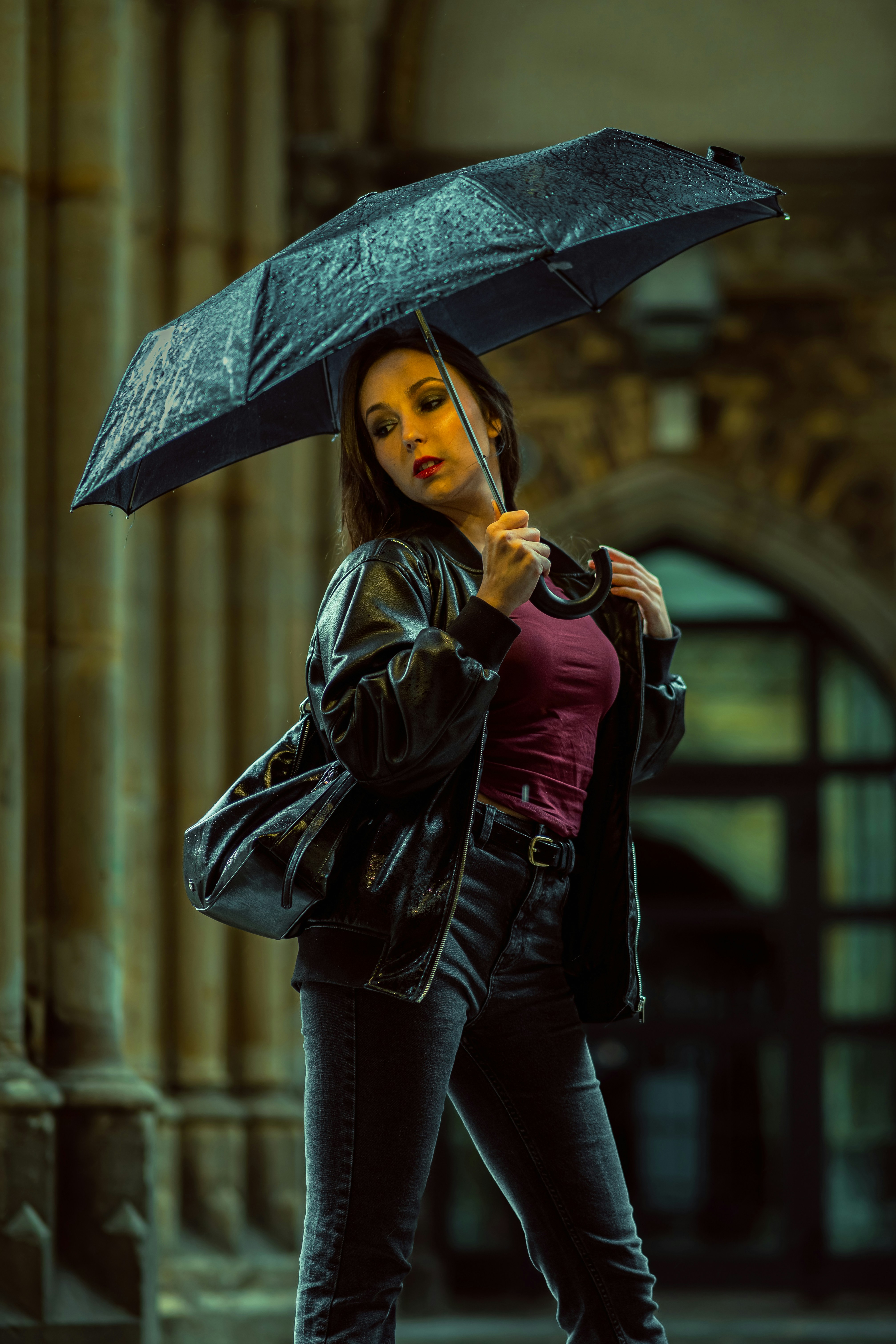 Umbrella Portrait in Rain-Kissed Urbanarch