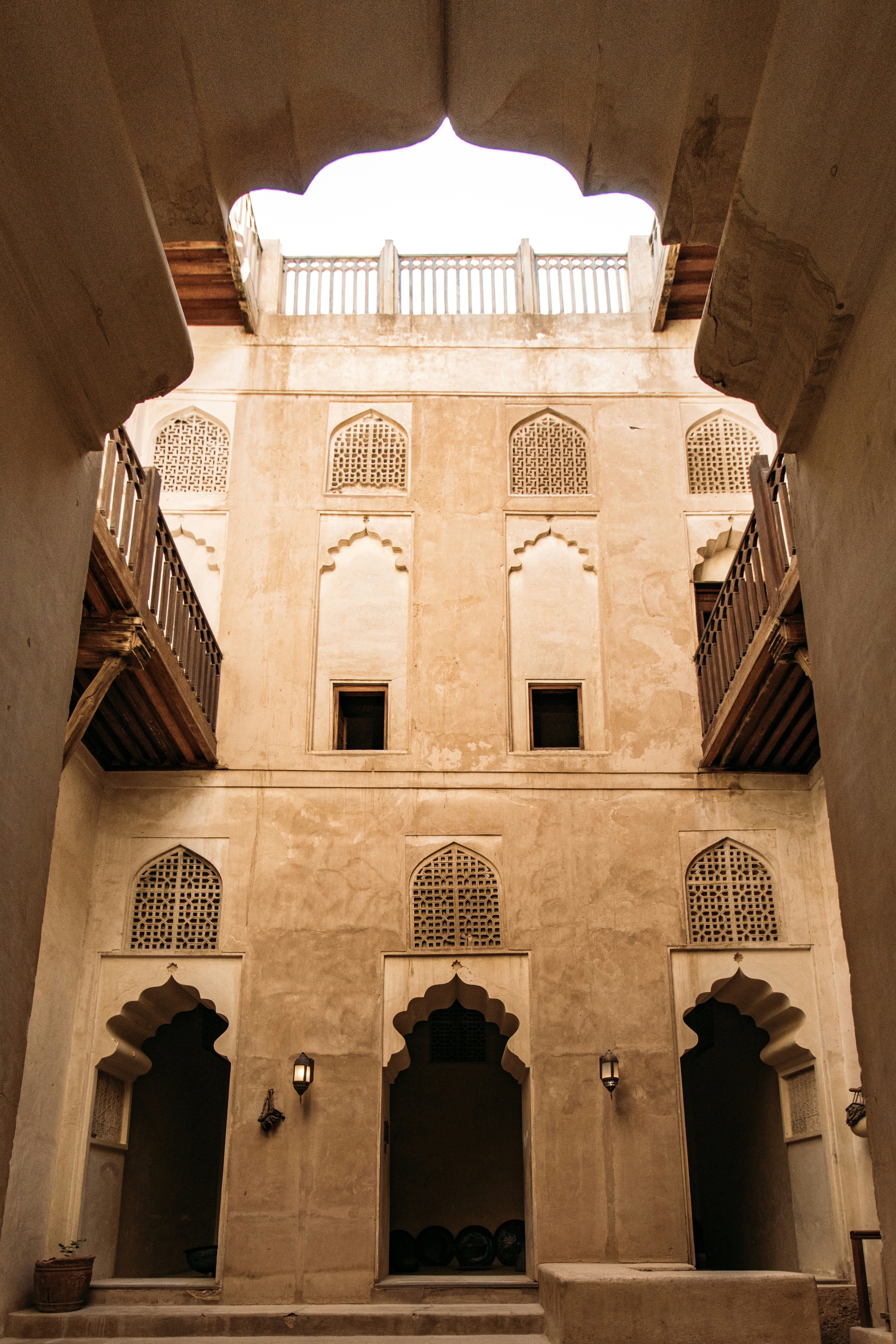 Courtyard of carved arches: sunlit symmetry in warm adobe