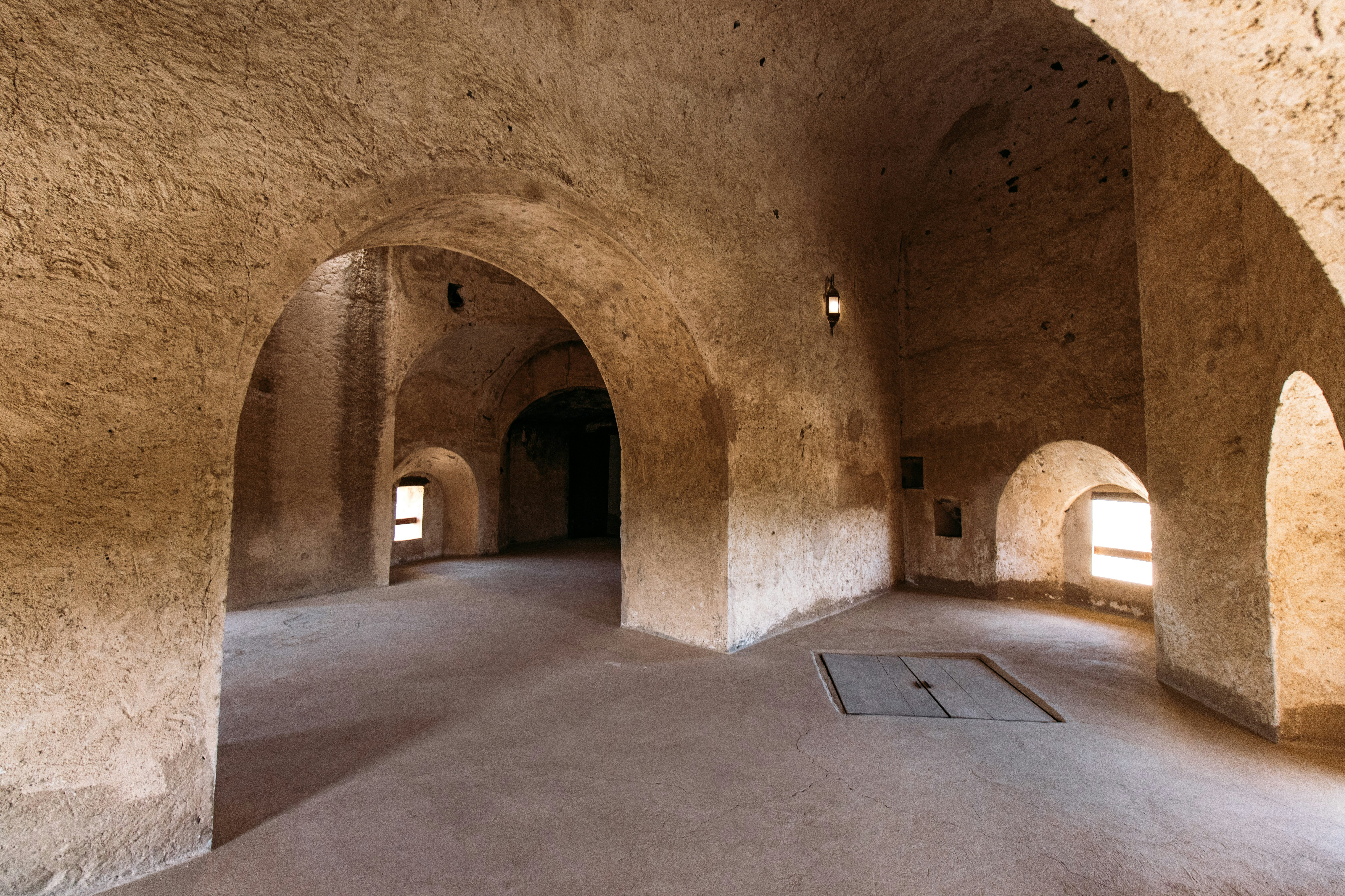 Echoes of Stone: An Archway Gallery in Soft Light