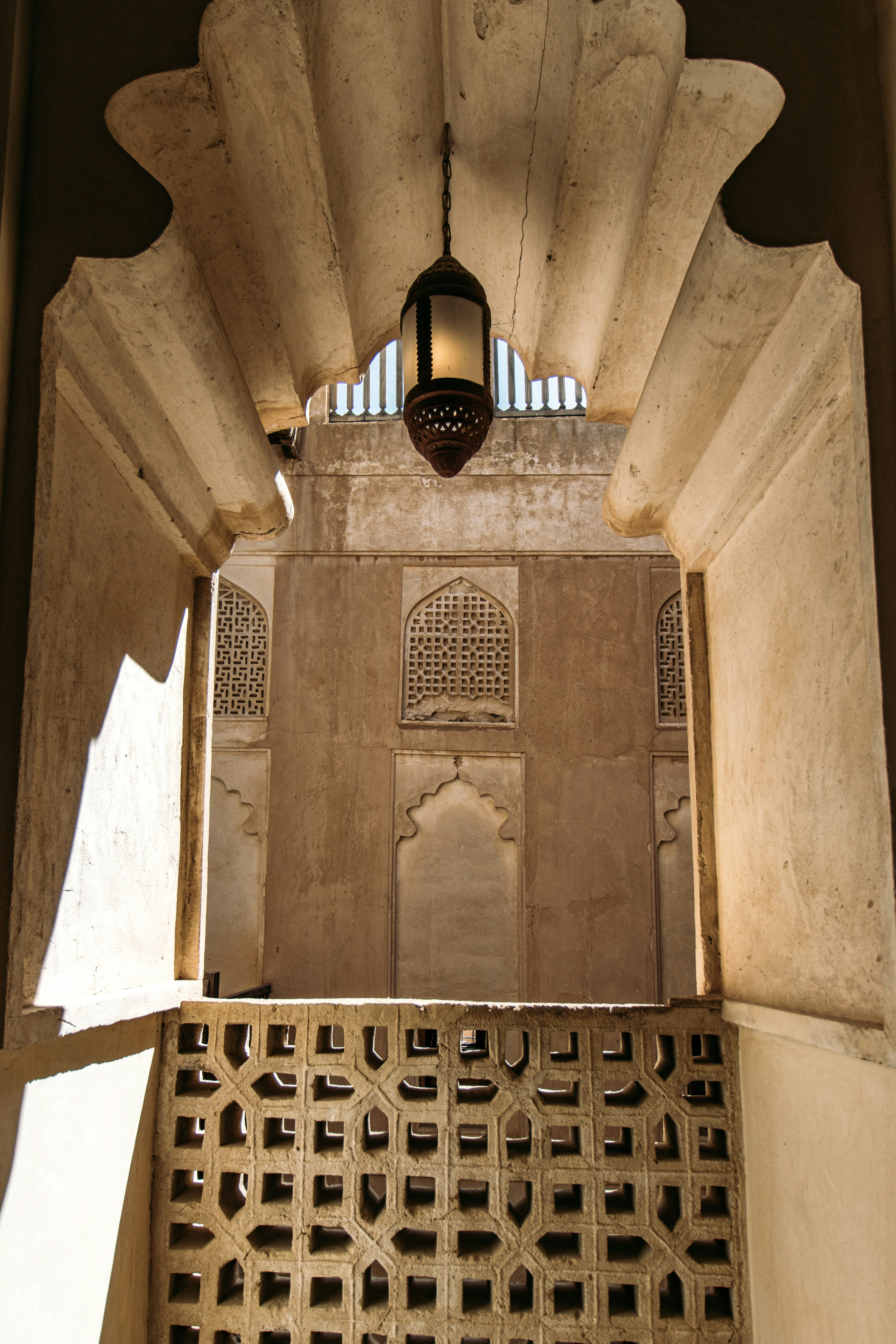 Lanterns and Lattice: Sunrise through a Caravanserai Arch