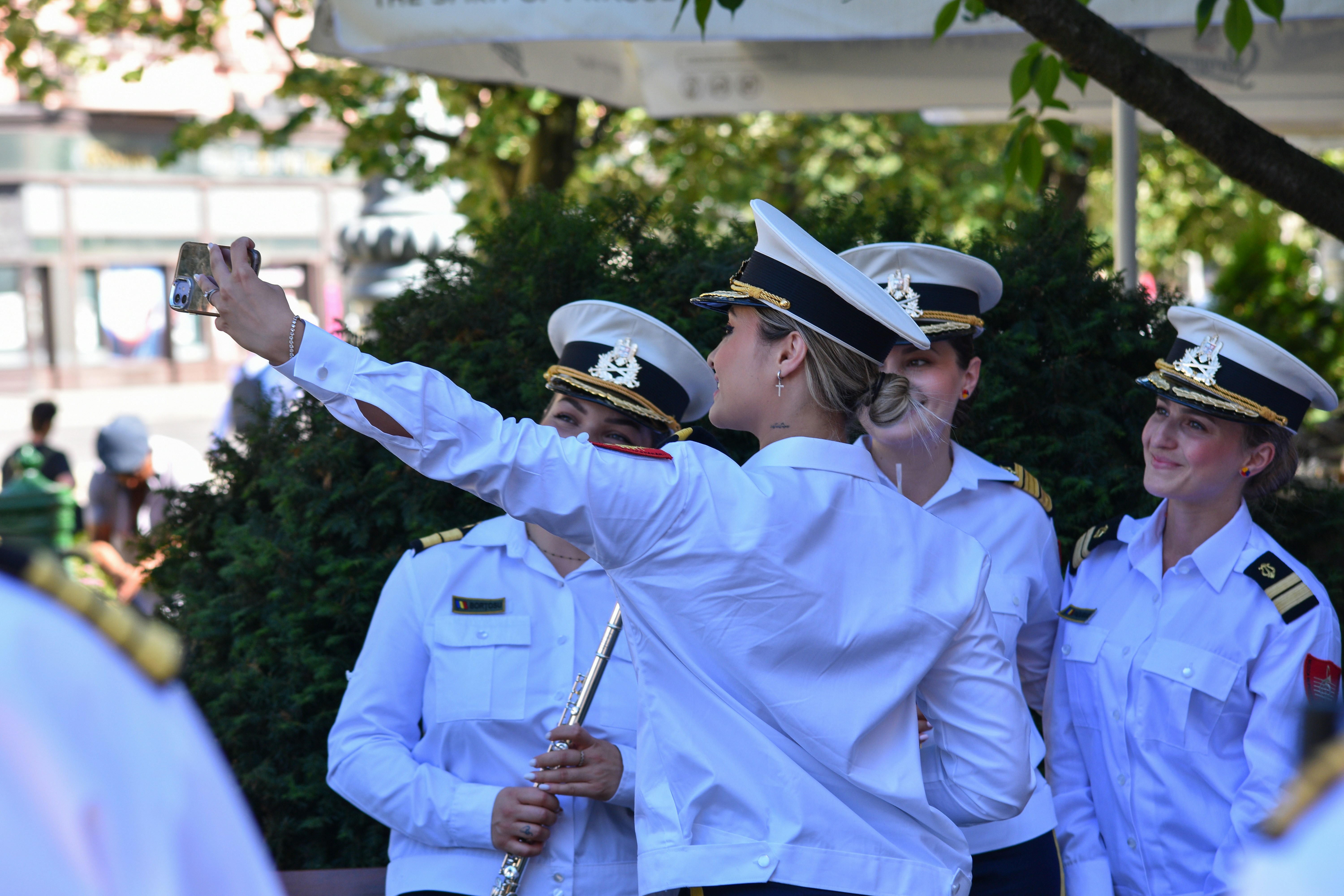 Uniformed selfie moment: cadets gather for a group shot during a parade practice
