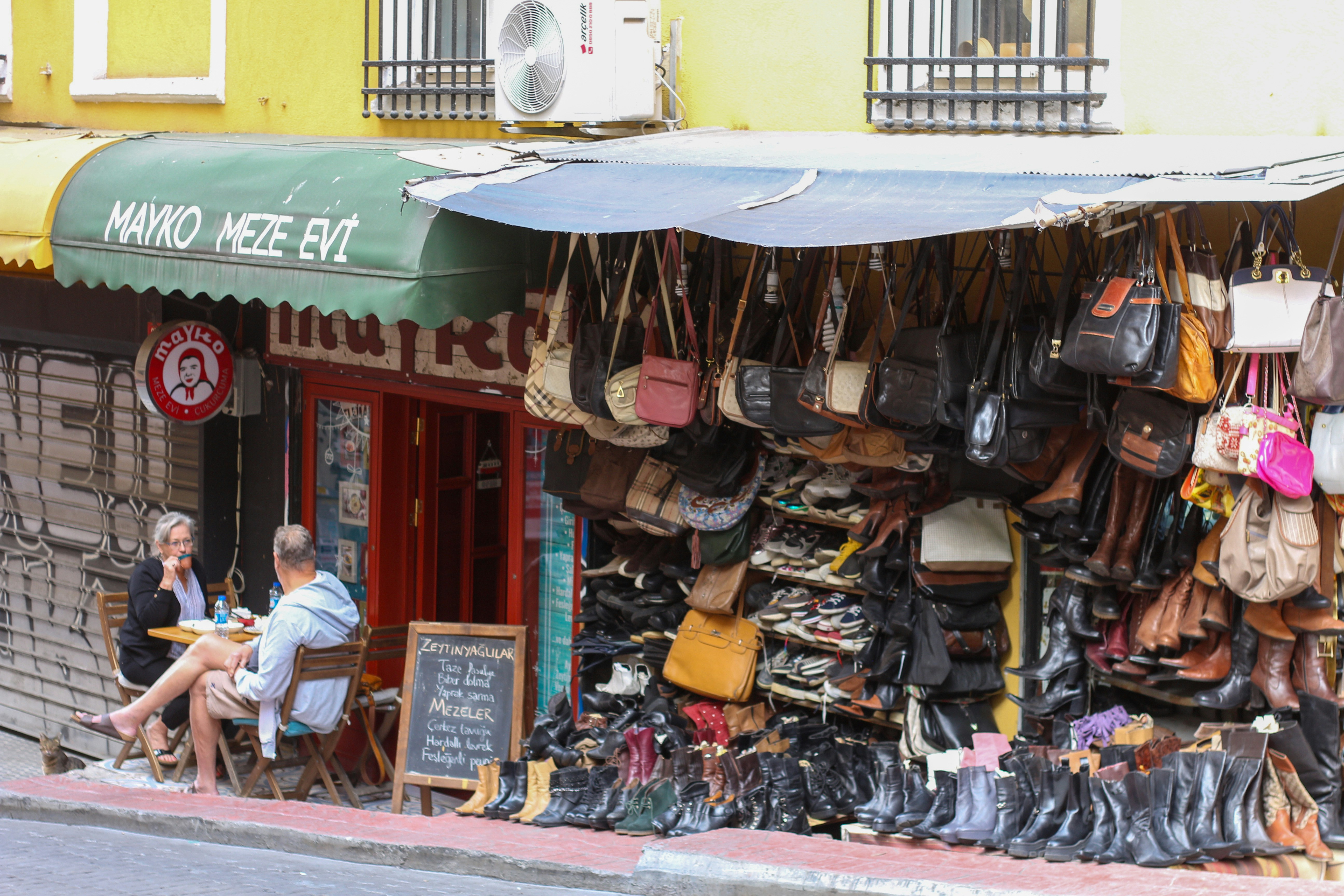 Shopfront Stacks: A Street Market of Bags under a Tarp