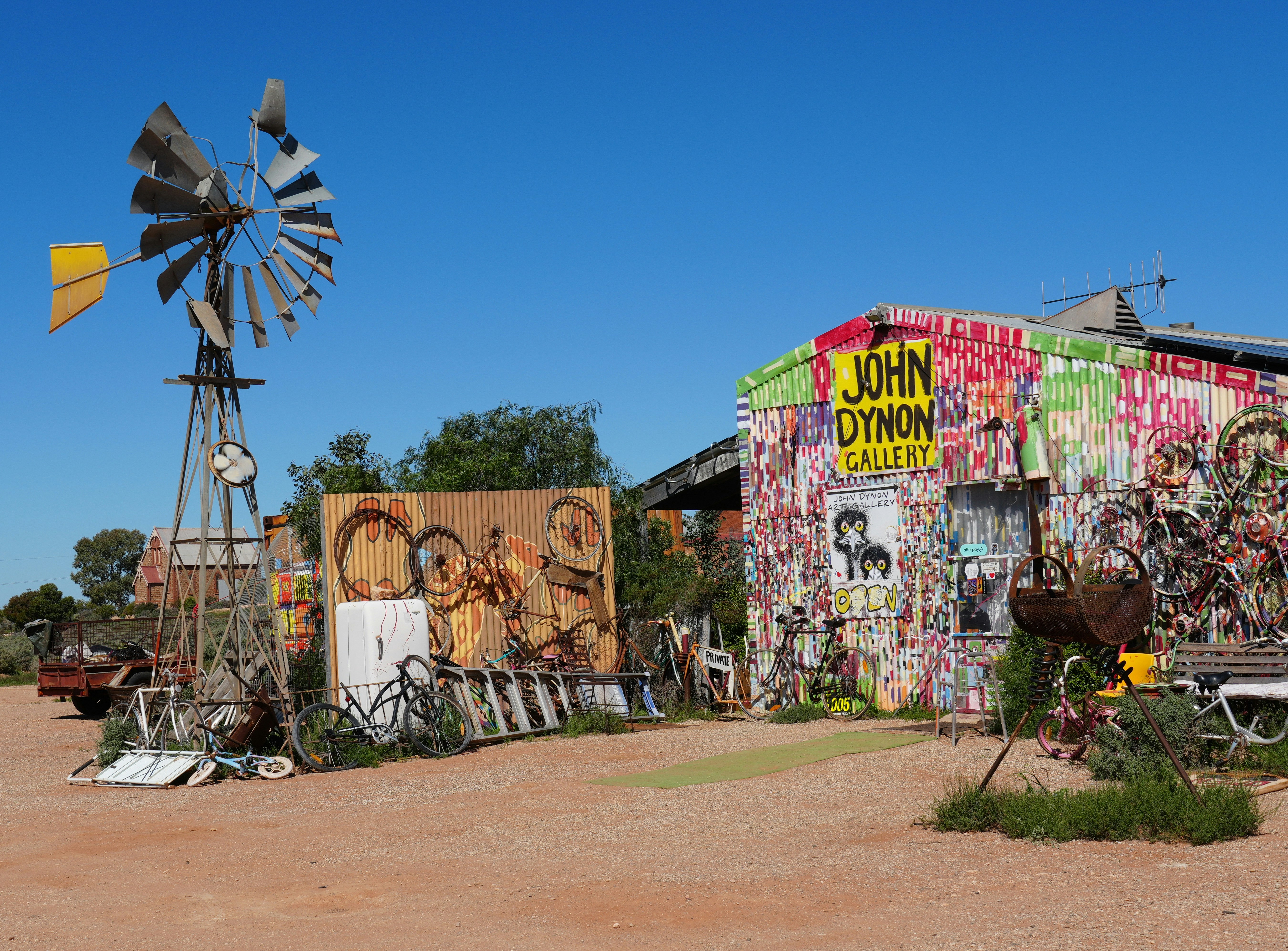 Desert Outpost of Color: An Arthouse Junkyard under a Clear Sky