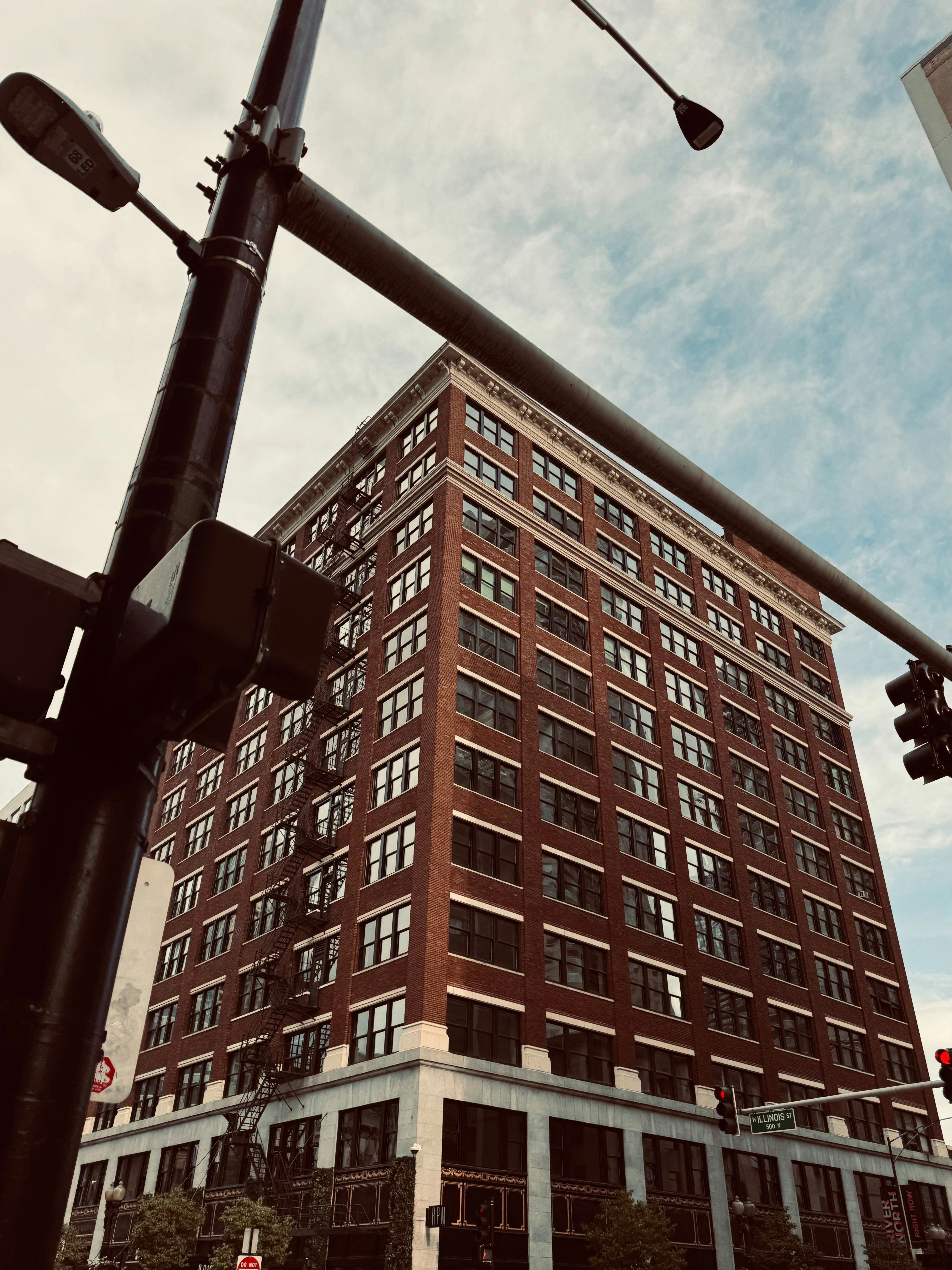 Urban Facade: Brick Corner Tower Rising Above a Downtown Street