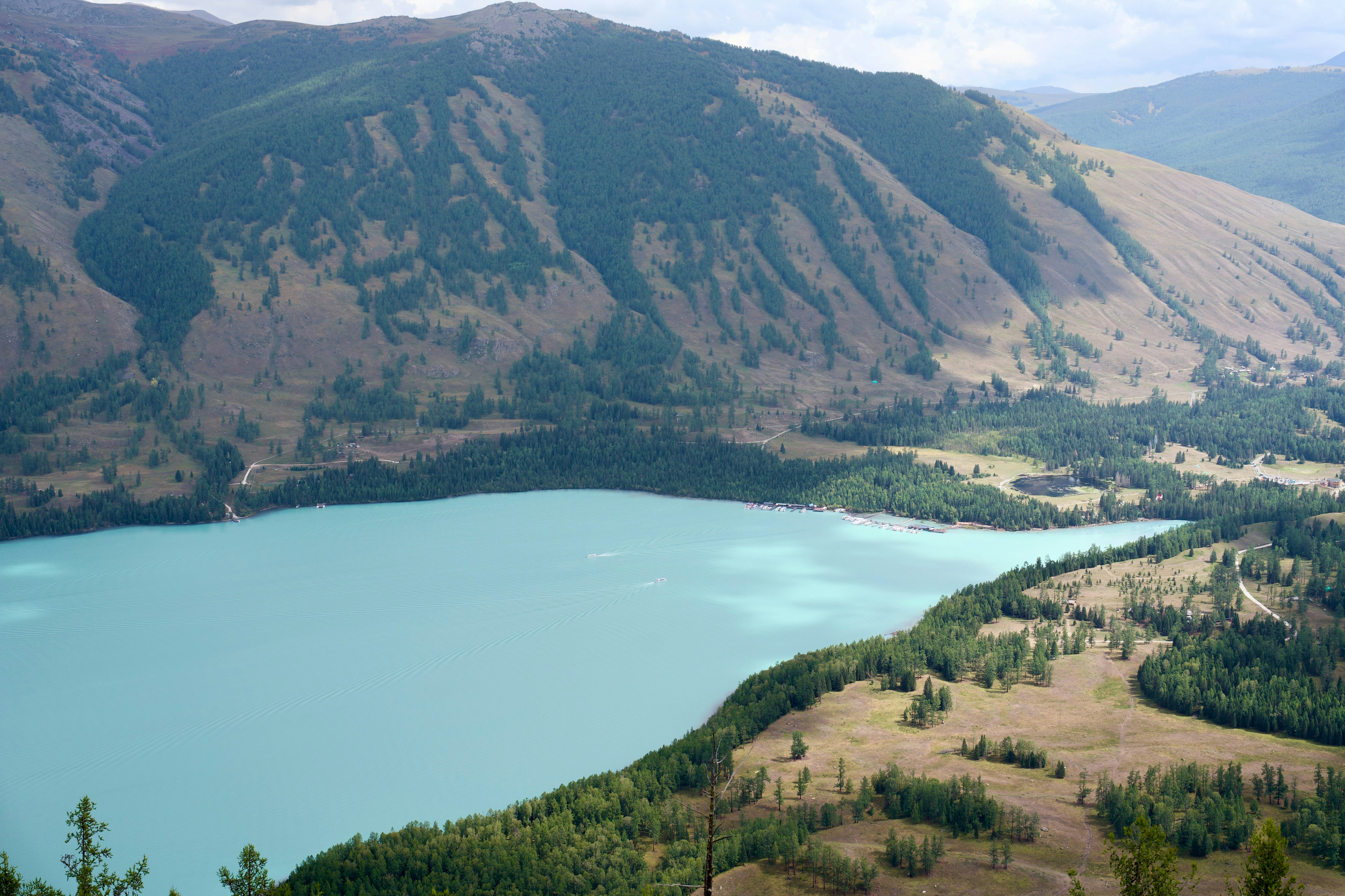 Emerald Basin: A Turquoise Lake Nestled Between Sunlit Slopes