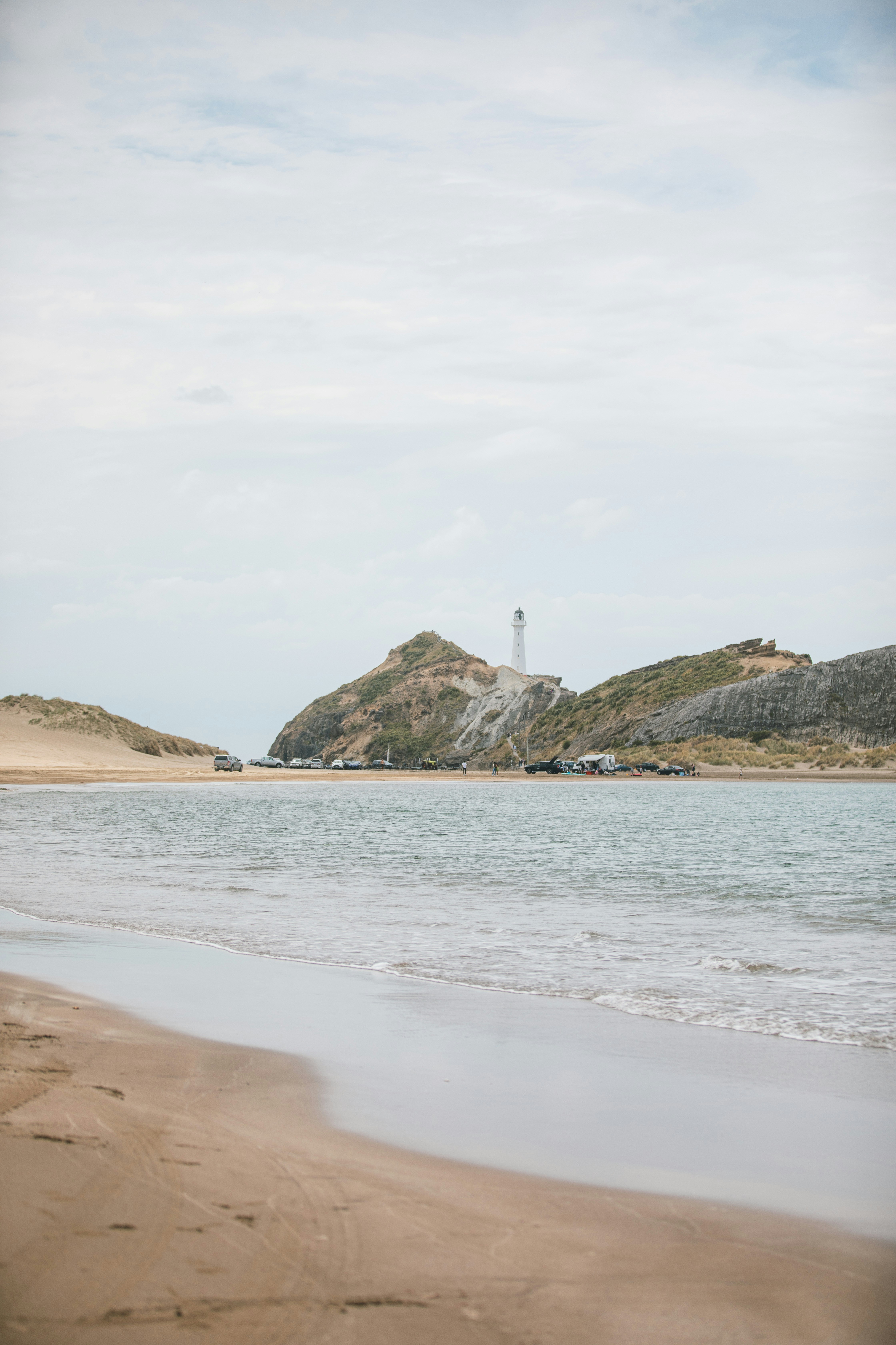 Lighthouse Sentinel over a Quiet Coastal Reach