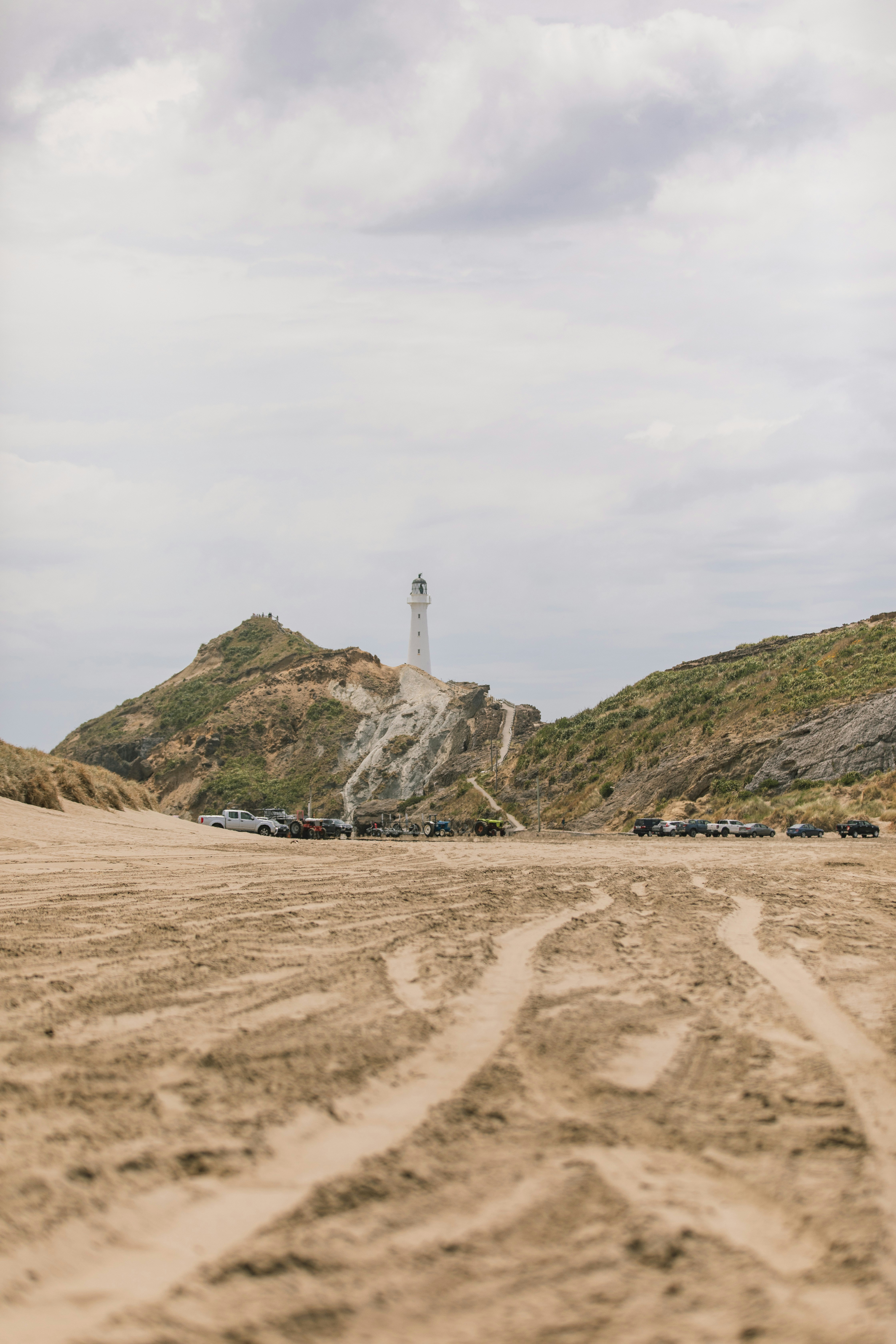 Beacon on the Dunes: A Lighthouse Guarding the Shore