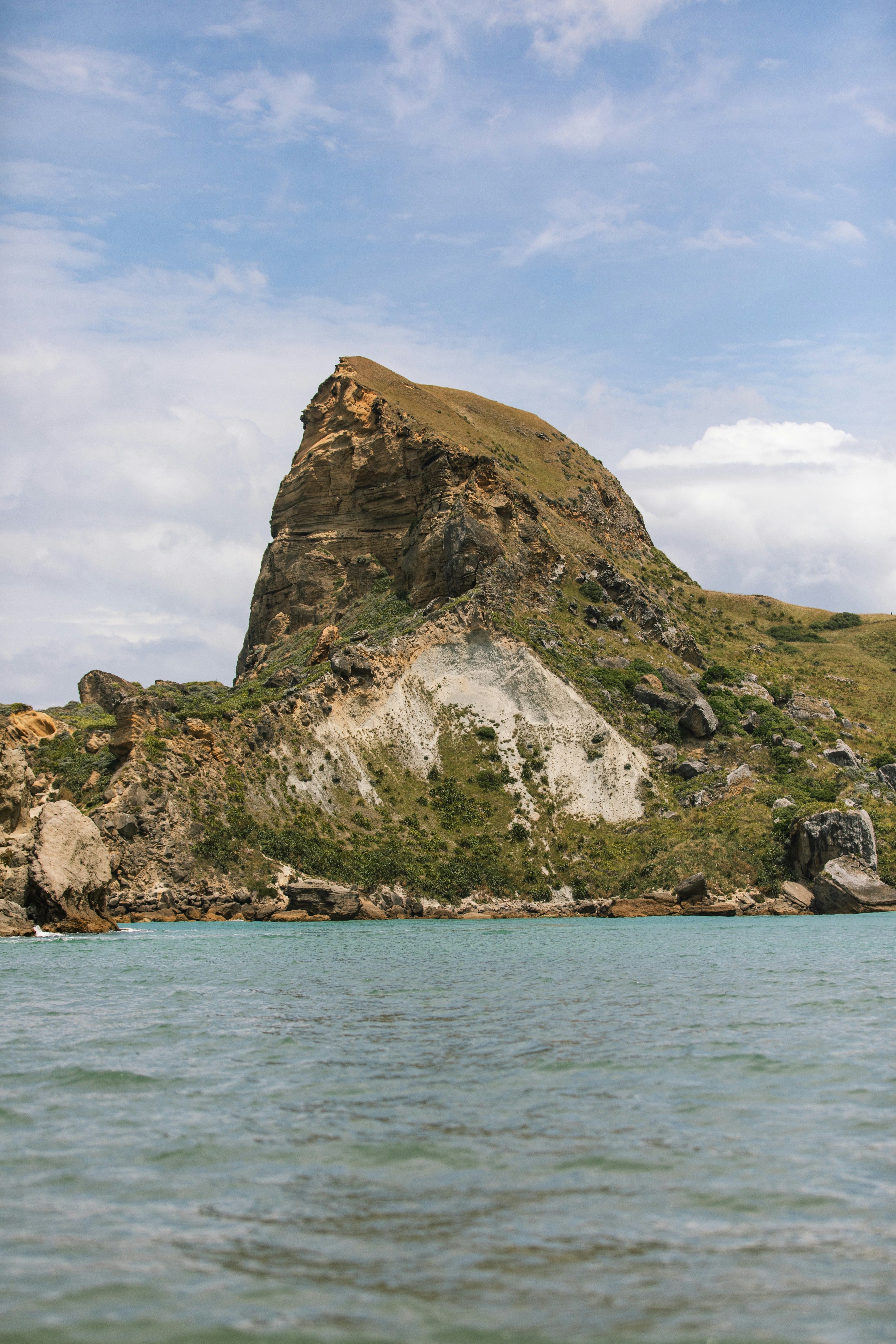 Sculpted Sea Sentinel: A Lone Promontory Rising from Calm Waters