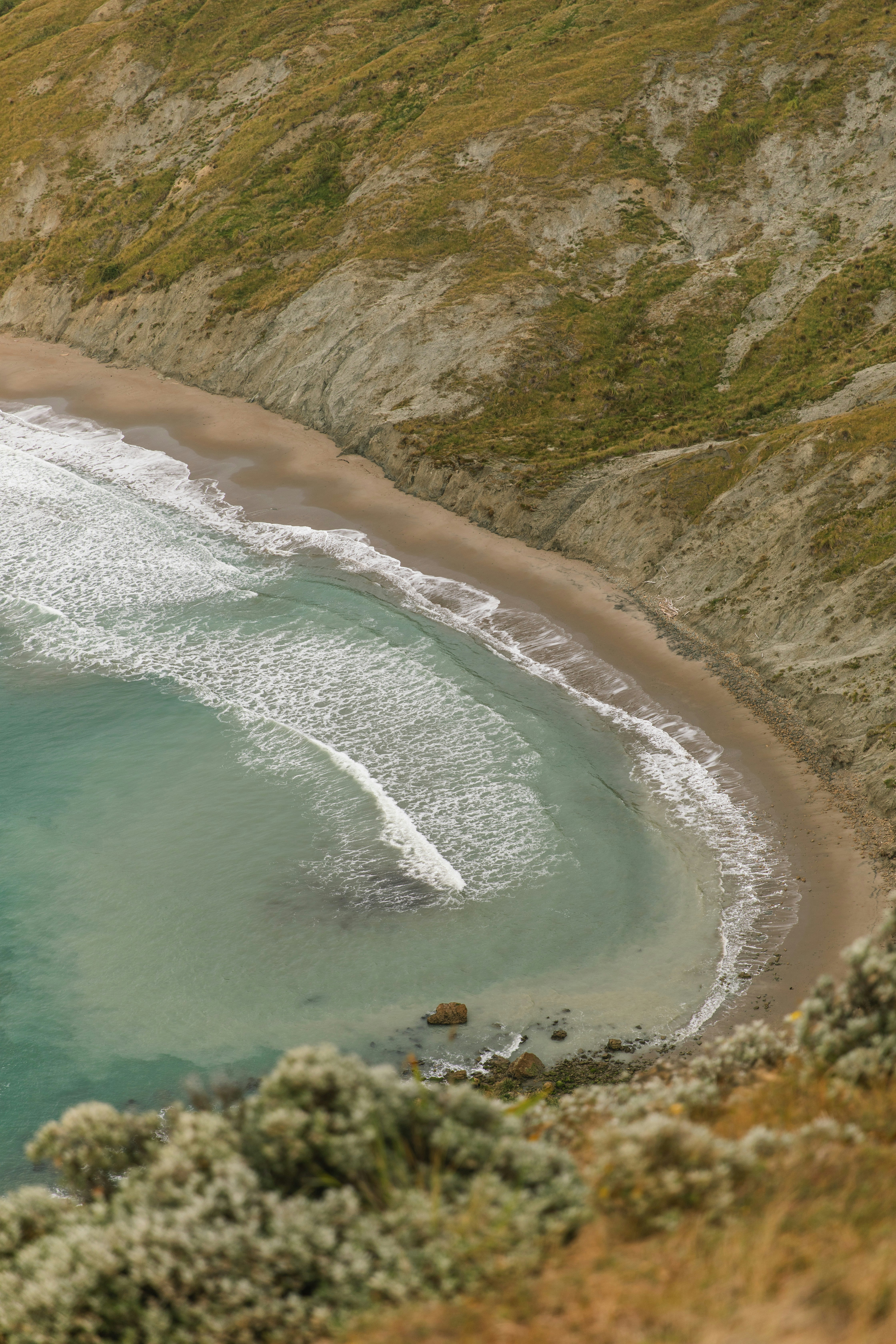 A Quiet Cove Curved by Cliffs and Oceanine Tones
