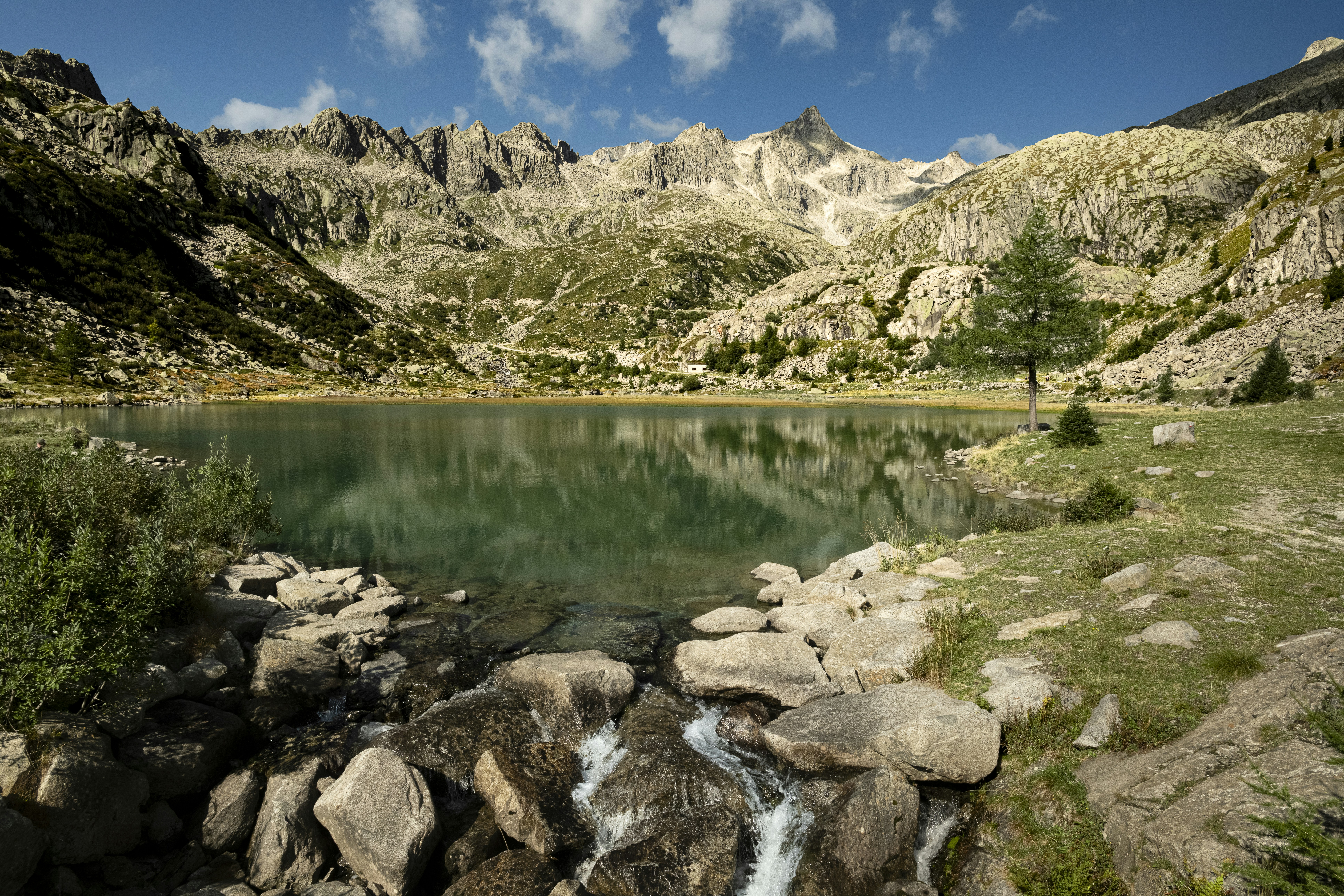 Crystal Mirror: Alpine Tarn Surrounded by Rugged Peaks
