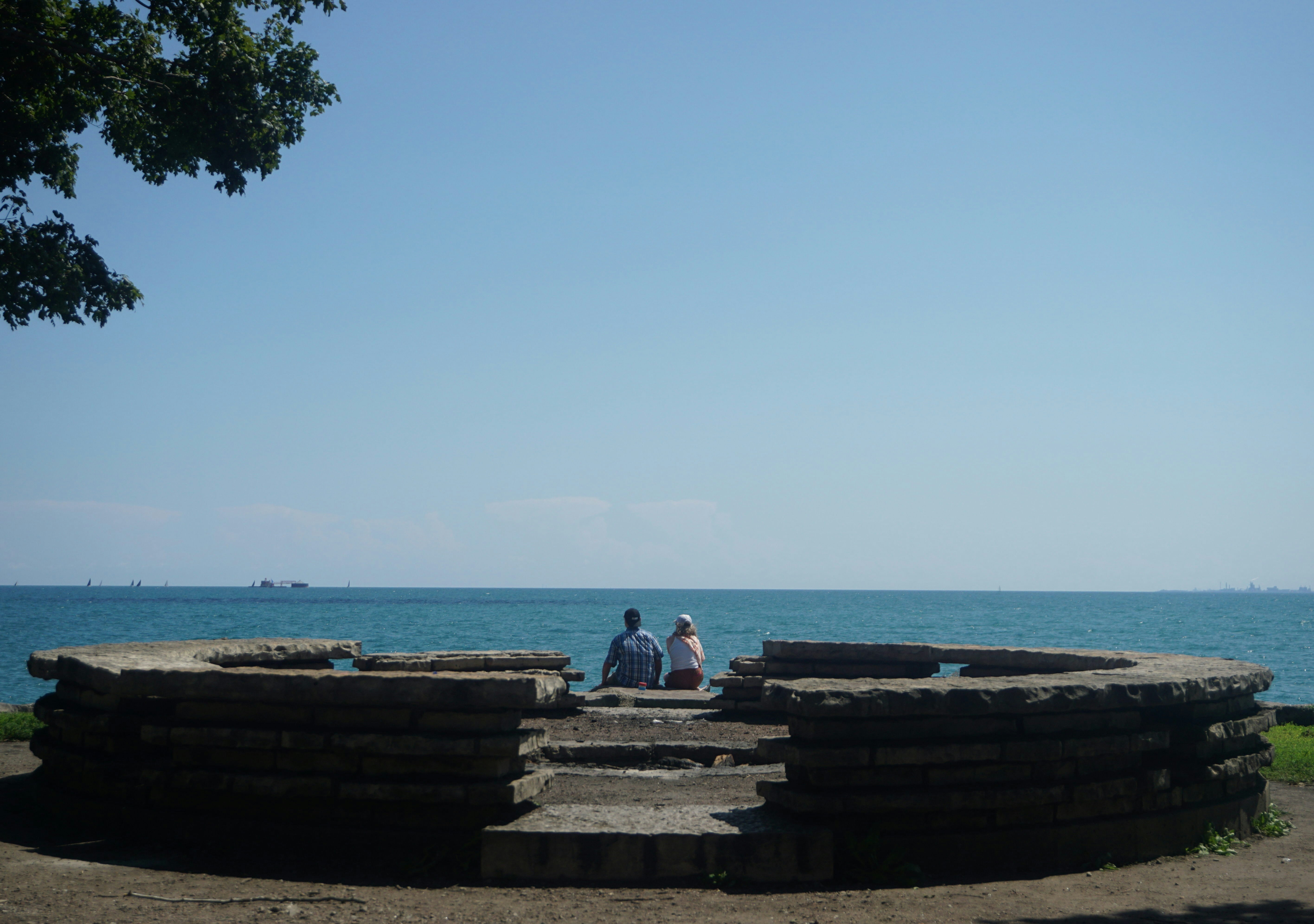 Seaside Terrace: Two Figures Beneath the Open Sky