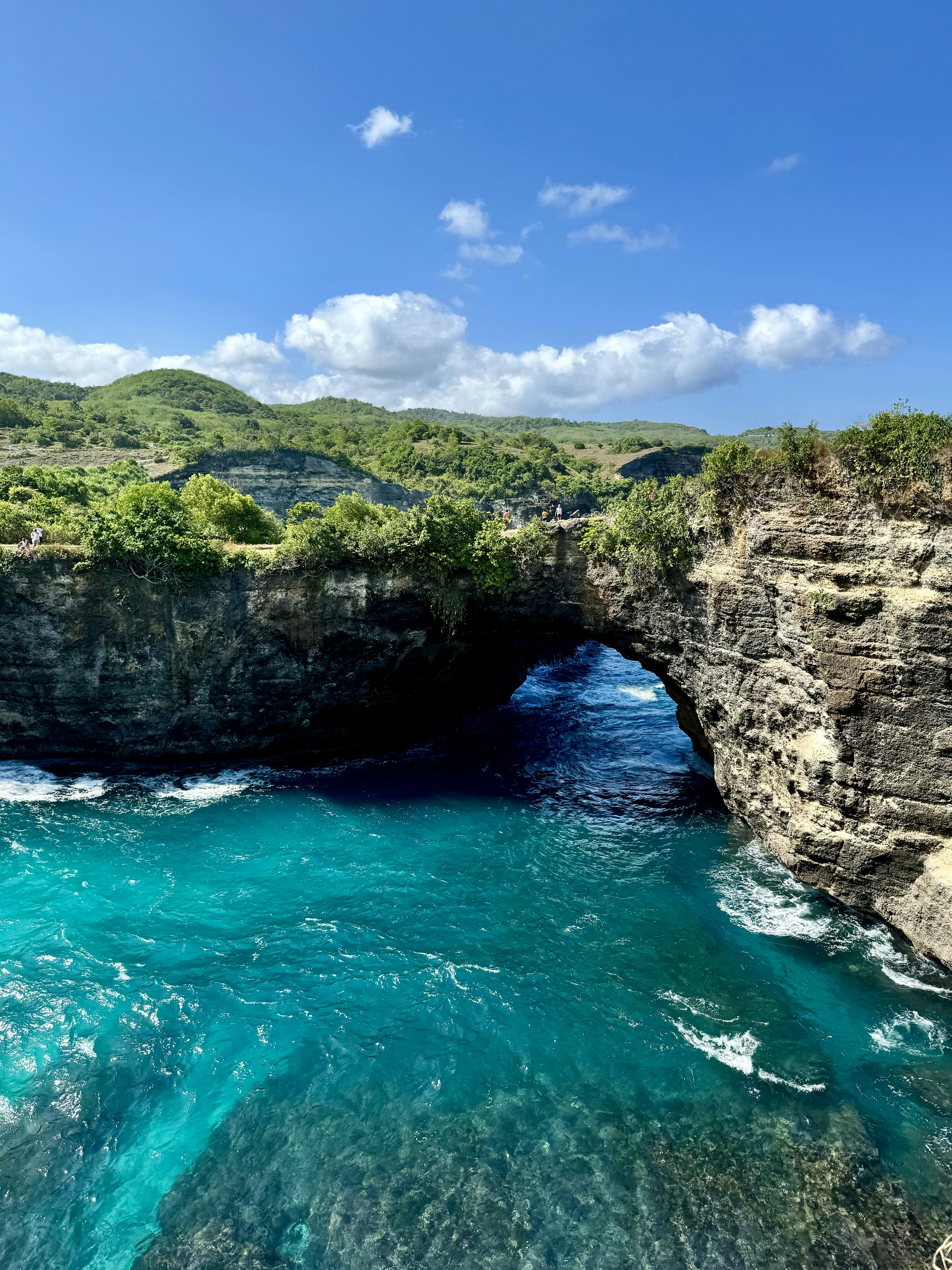 Azure Arch: Cliffside Sea Gate over Turquoise Waters