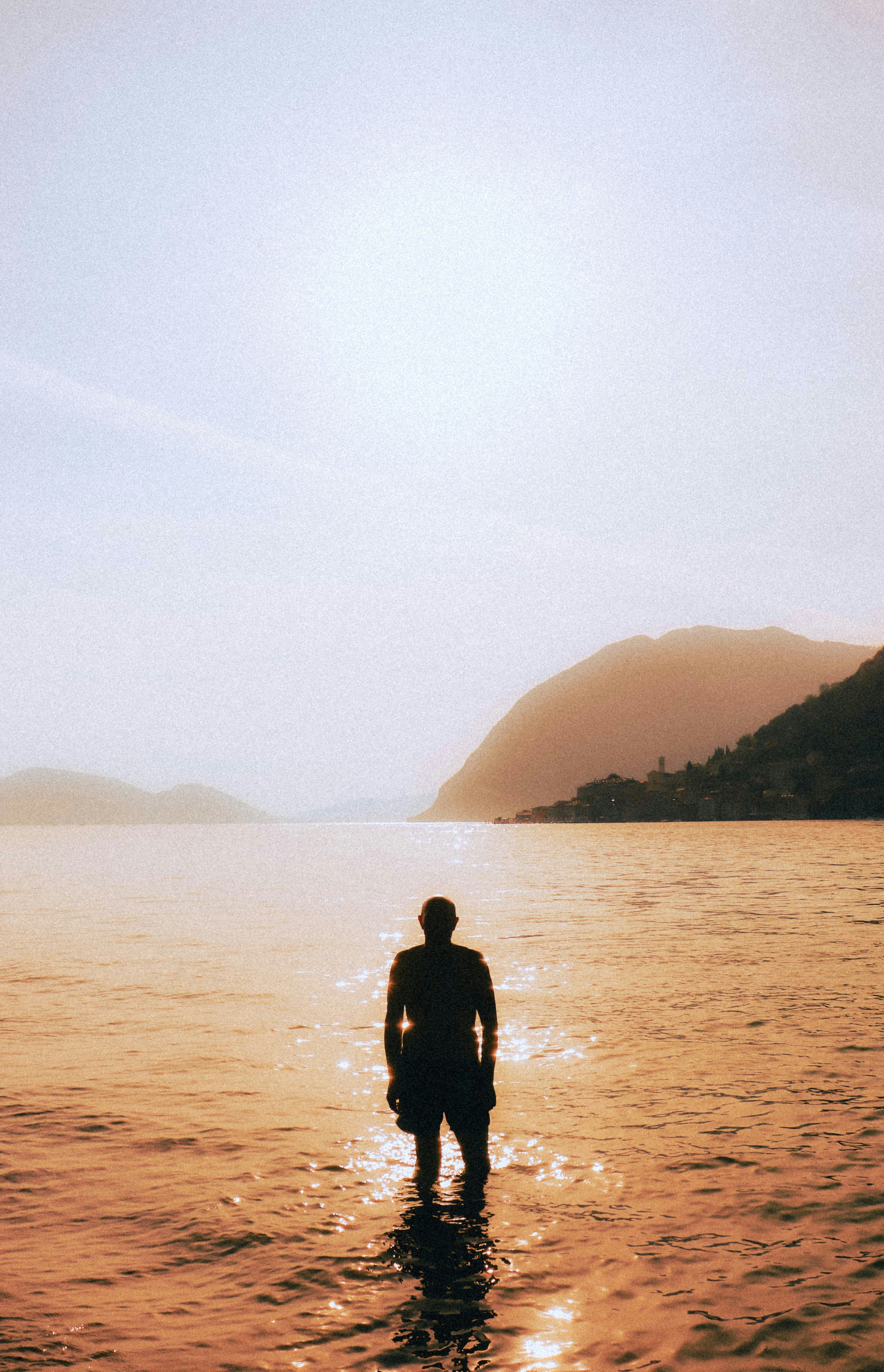 Solitary Figure at Sunset: A Silhouette in Quiet Seas
