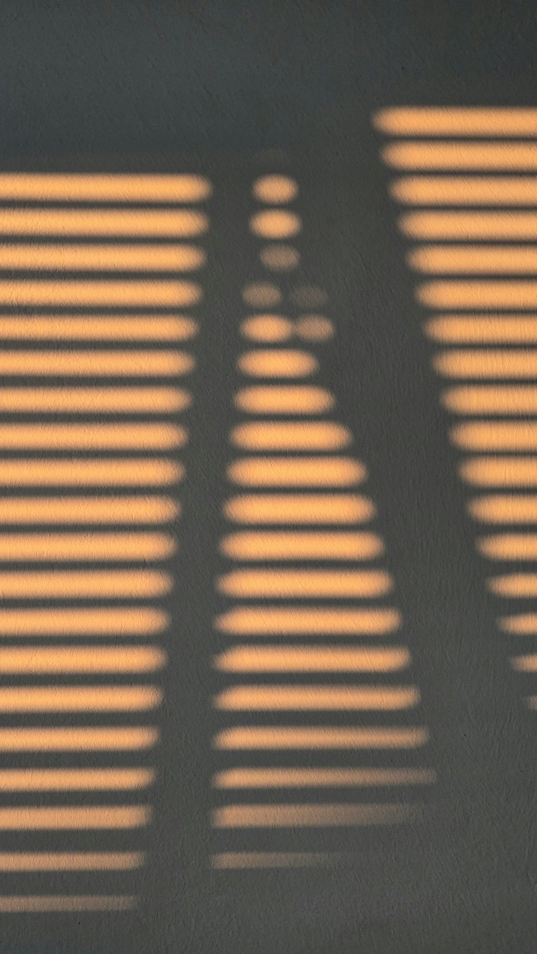 Shuttered Sunset Stripes on a Textured Surface
