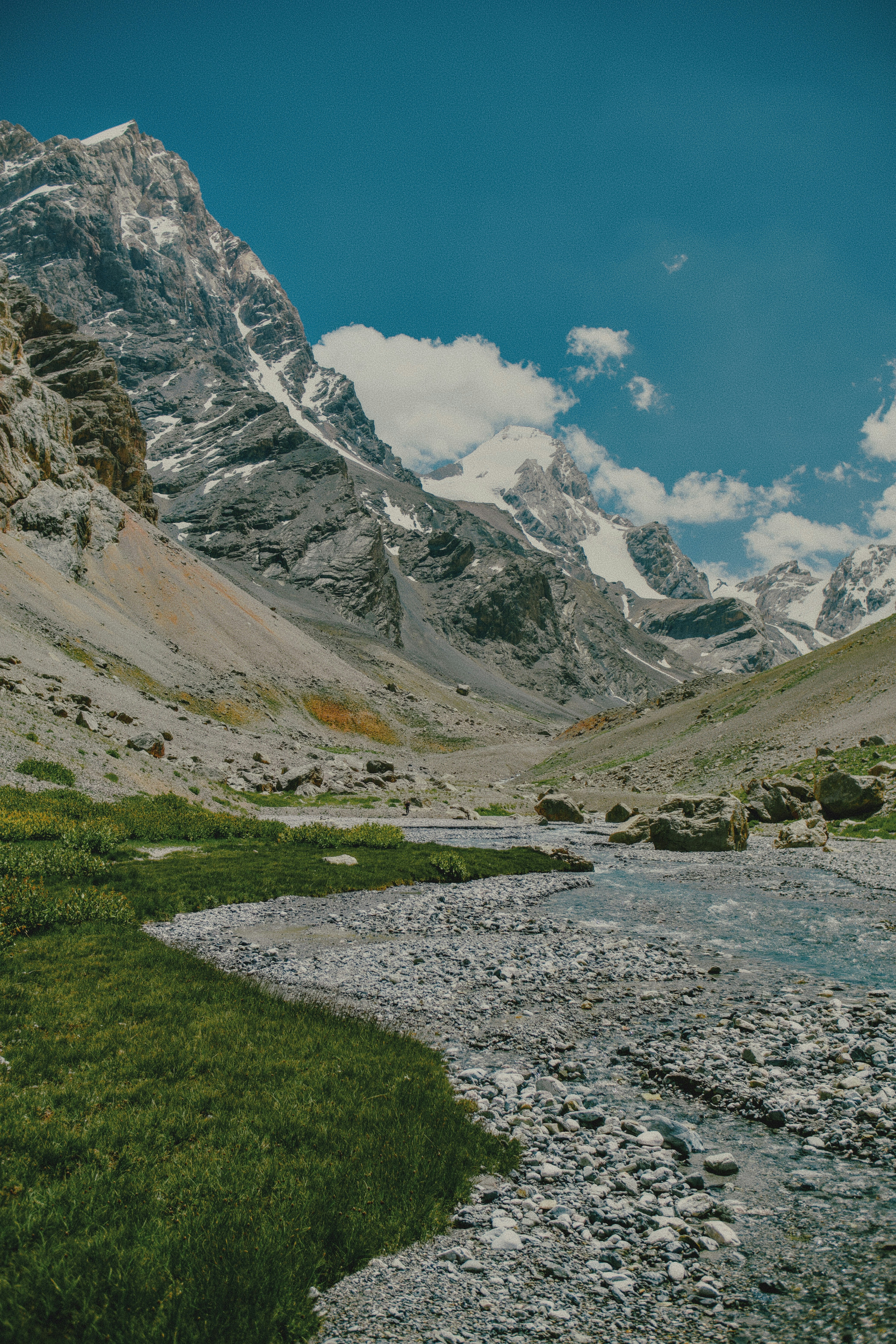 Glacial Valley under a Brisk Alpine Sky