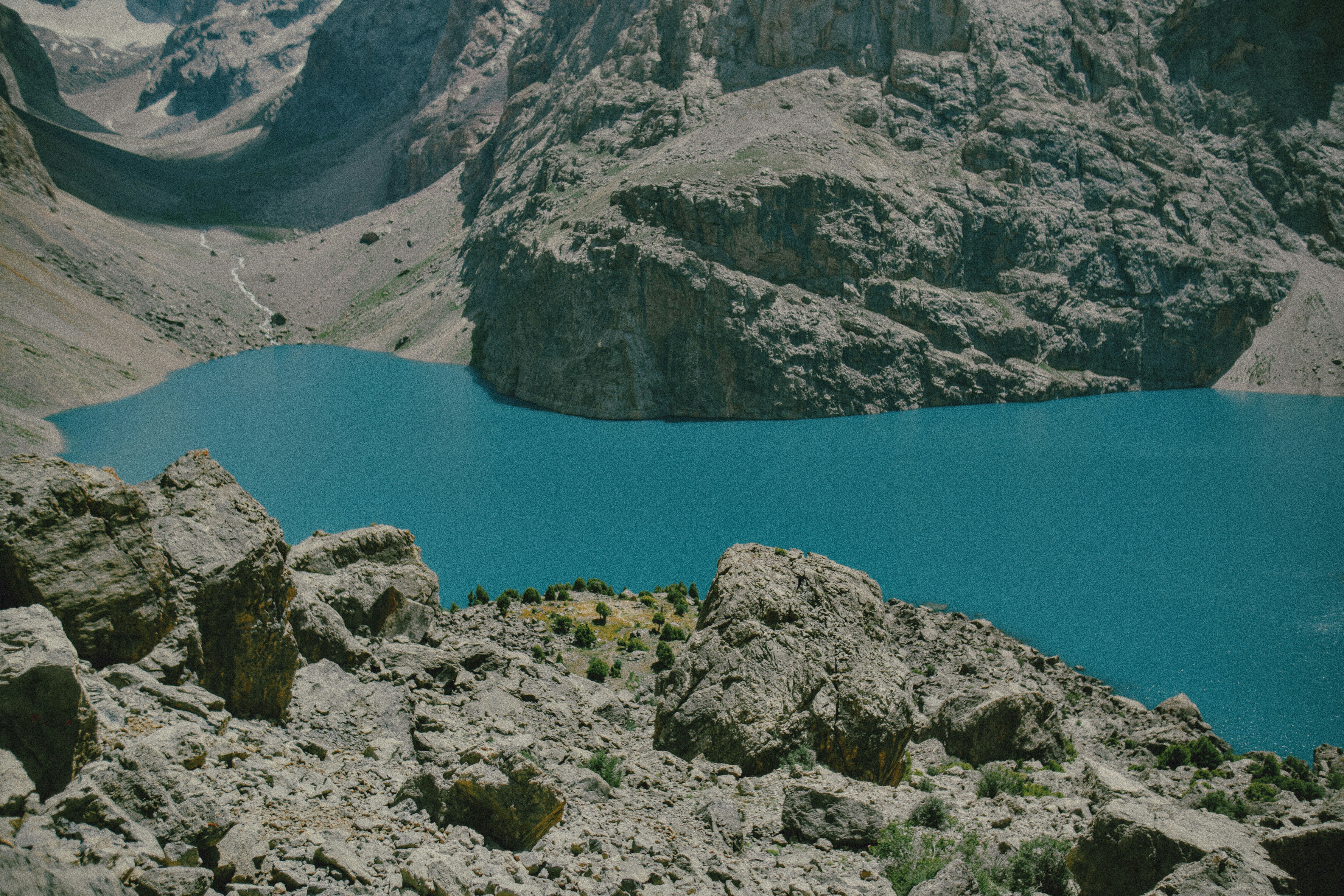 Azure Alpine Tarn Surrounded by rugged granite