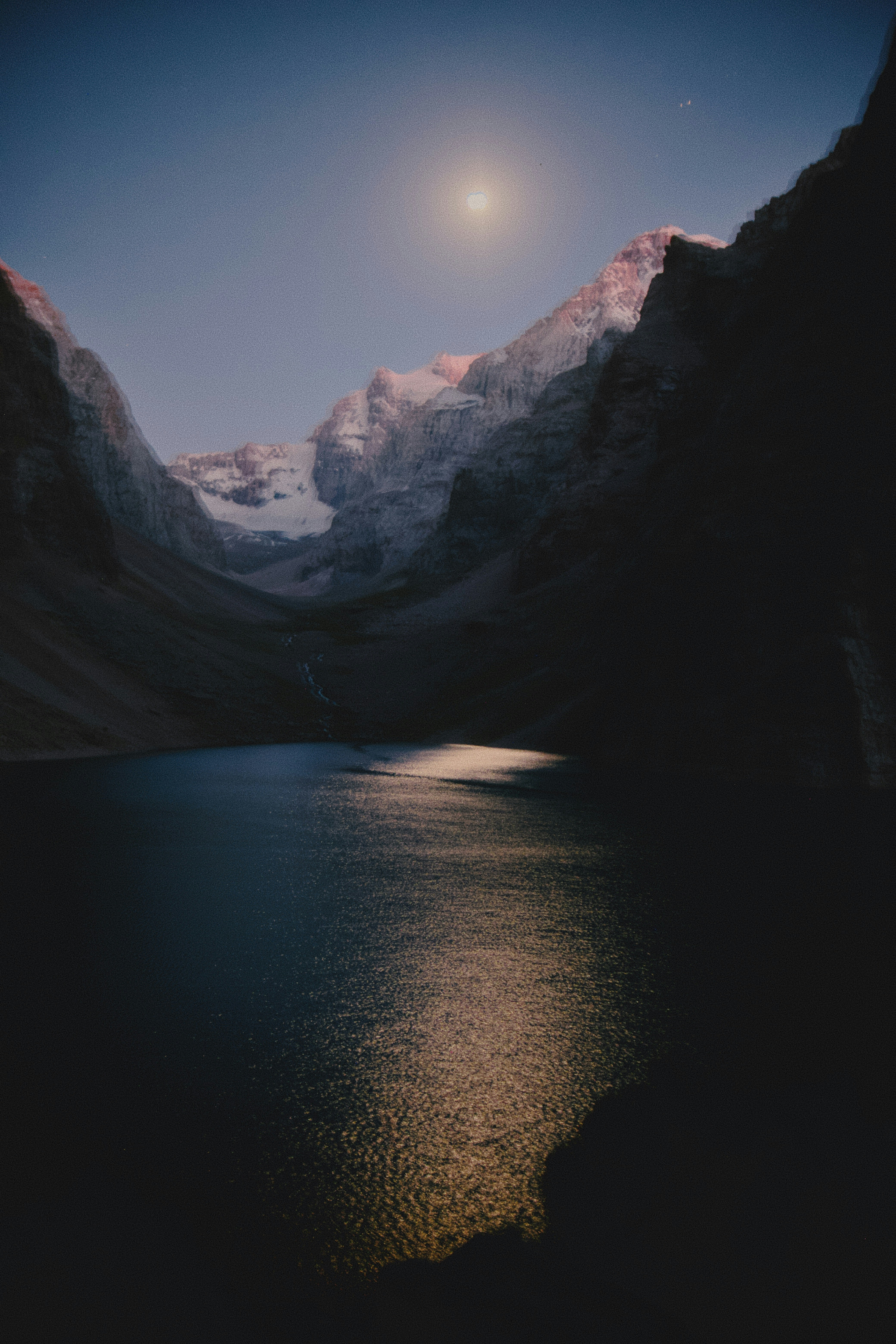 Moonlit Fjord: Glacial Peaks and Reflected Silence