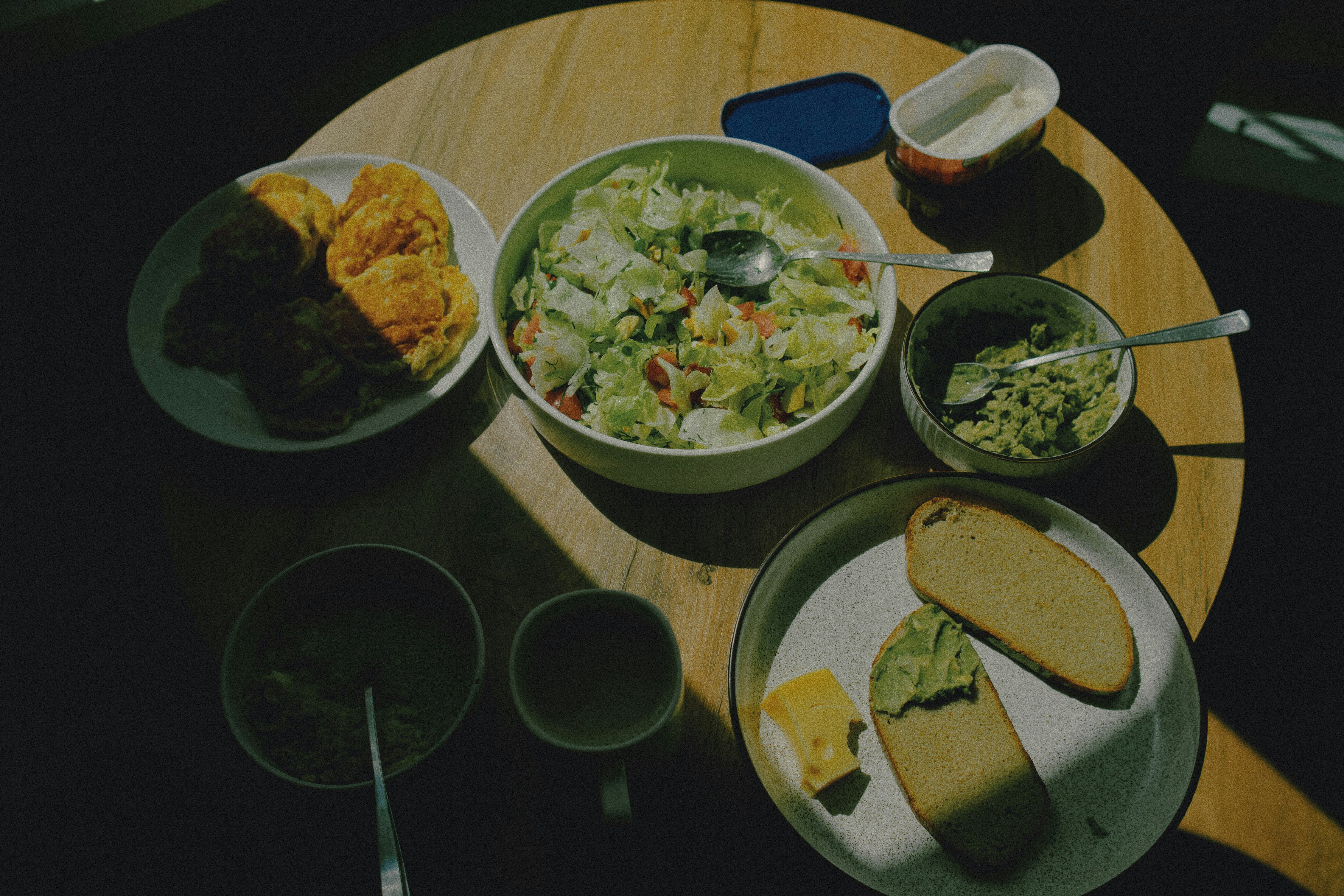Sunlit Bistro Bounty: A Shared Table of Greens and Grains