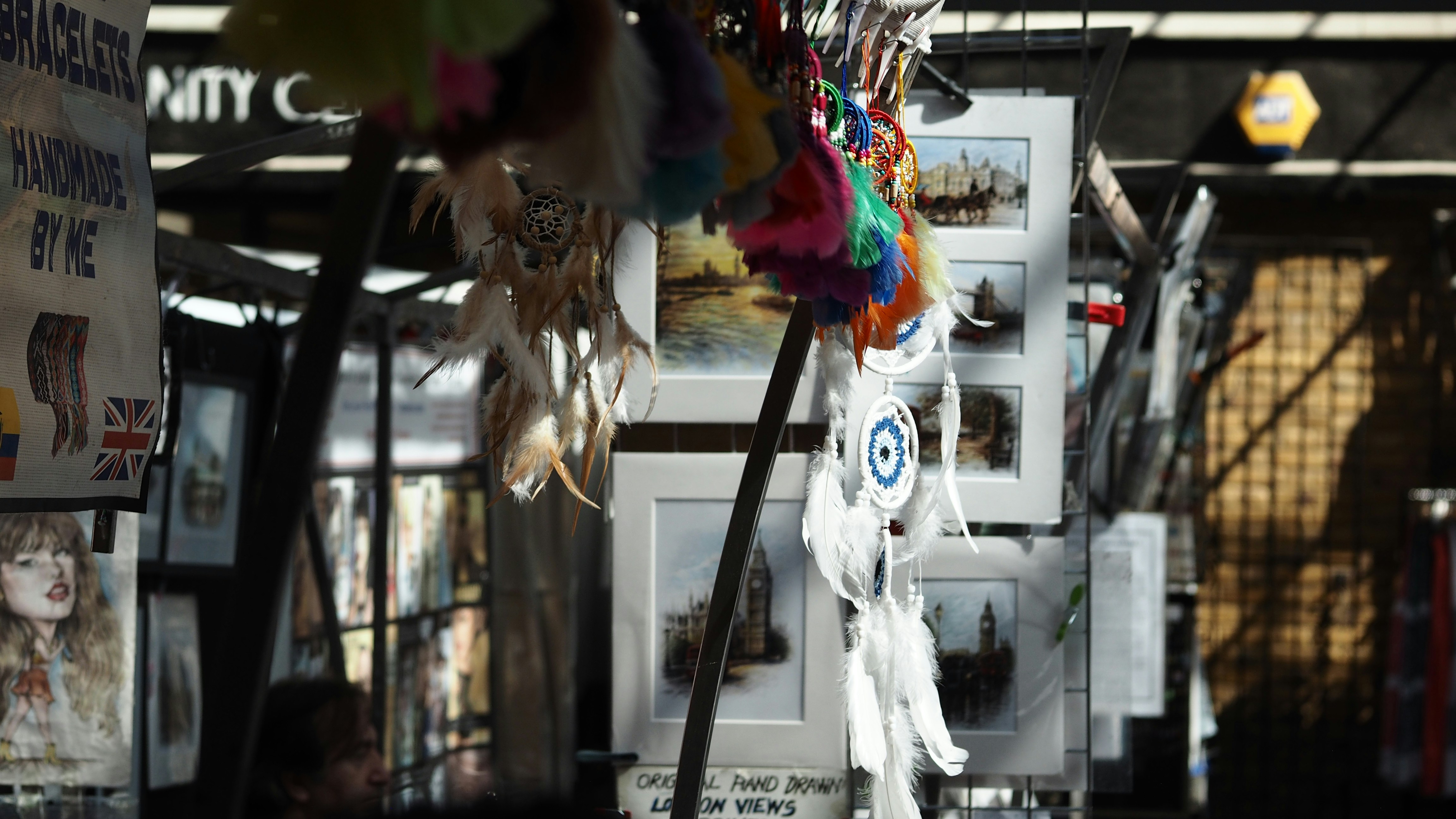 Dreamcatchers with colorful feathers hanging at a market stall in London