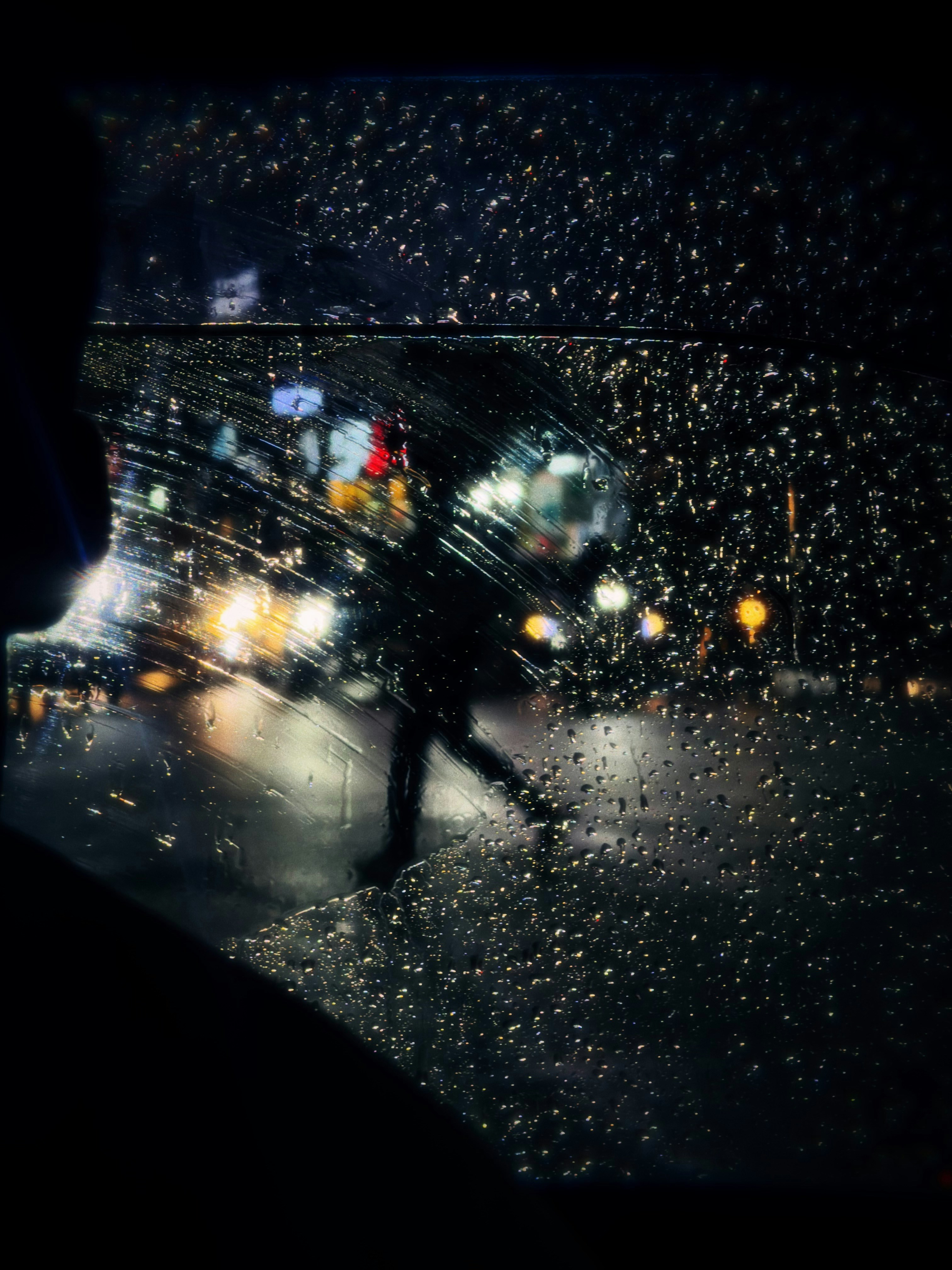 Rain-Splashed Night: A Figure Crossing the Neon Wet