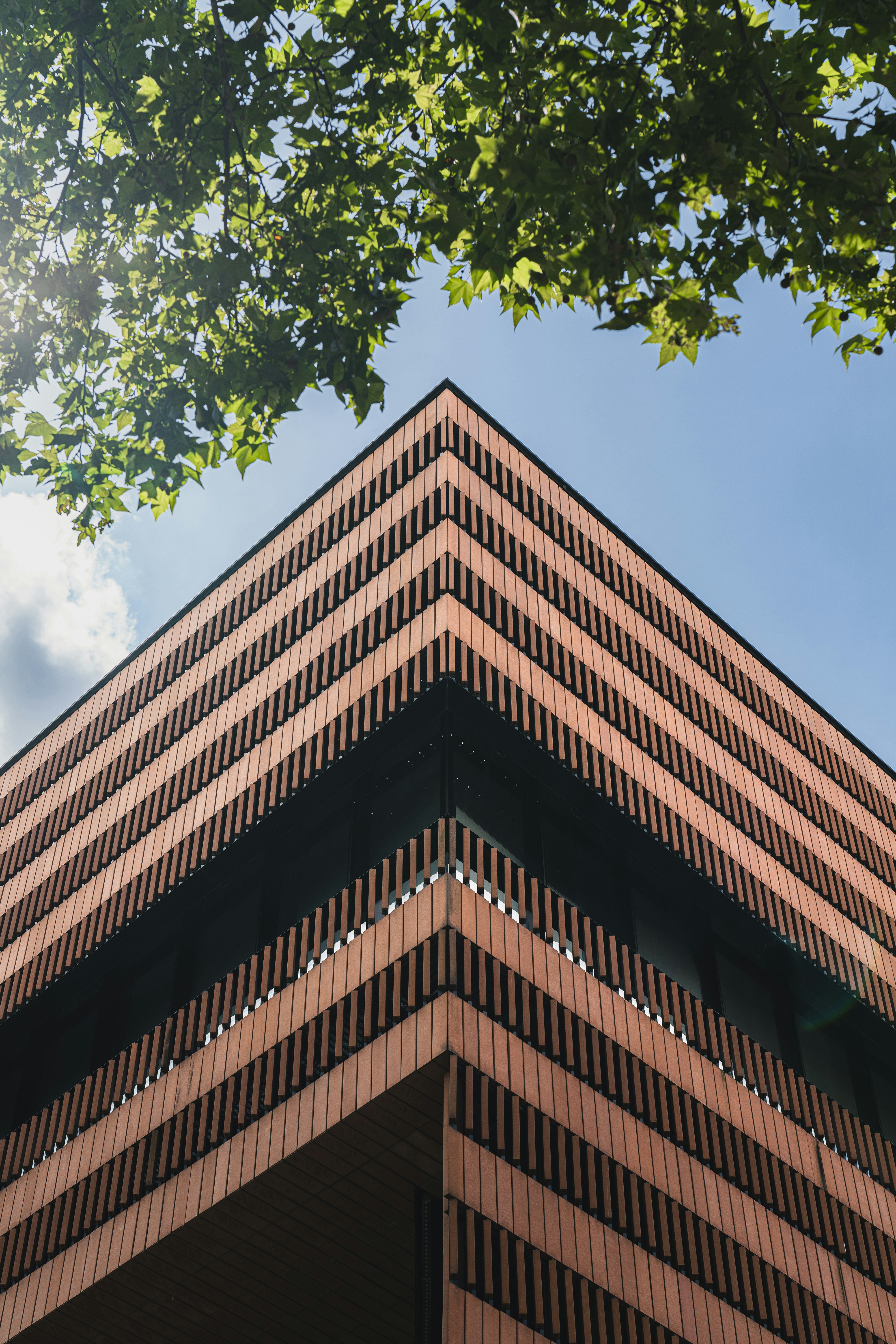 Angled Brick Monolith Reaching Toward a Blue Sky
