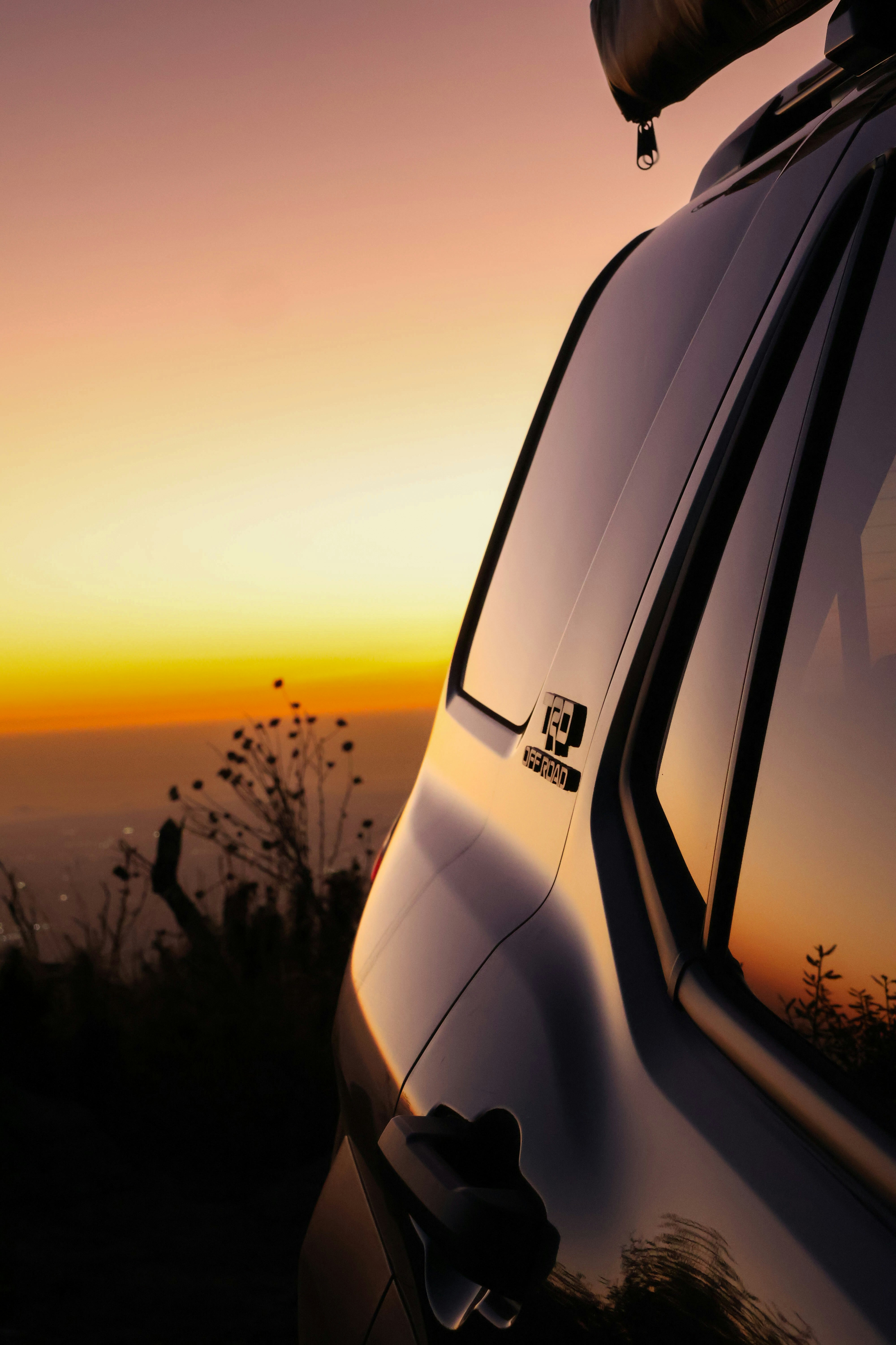 Sunset Reflections on a Curved Silhouette
