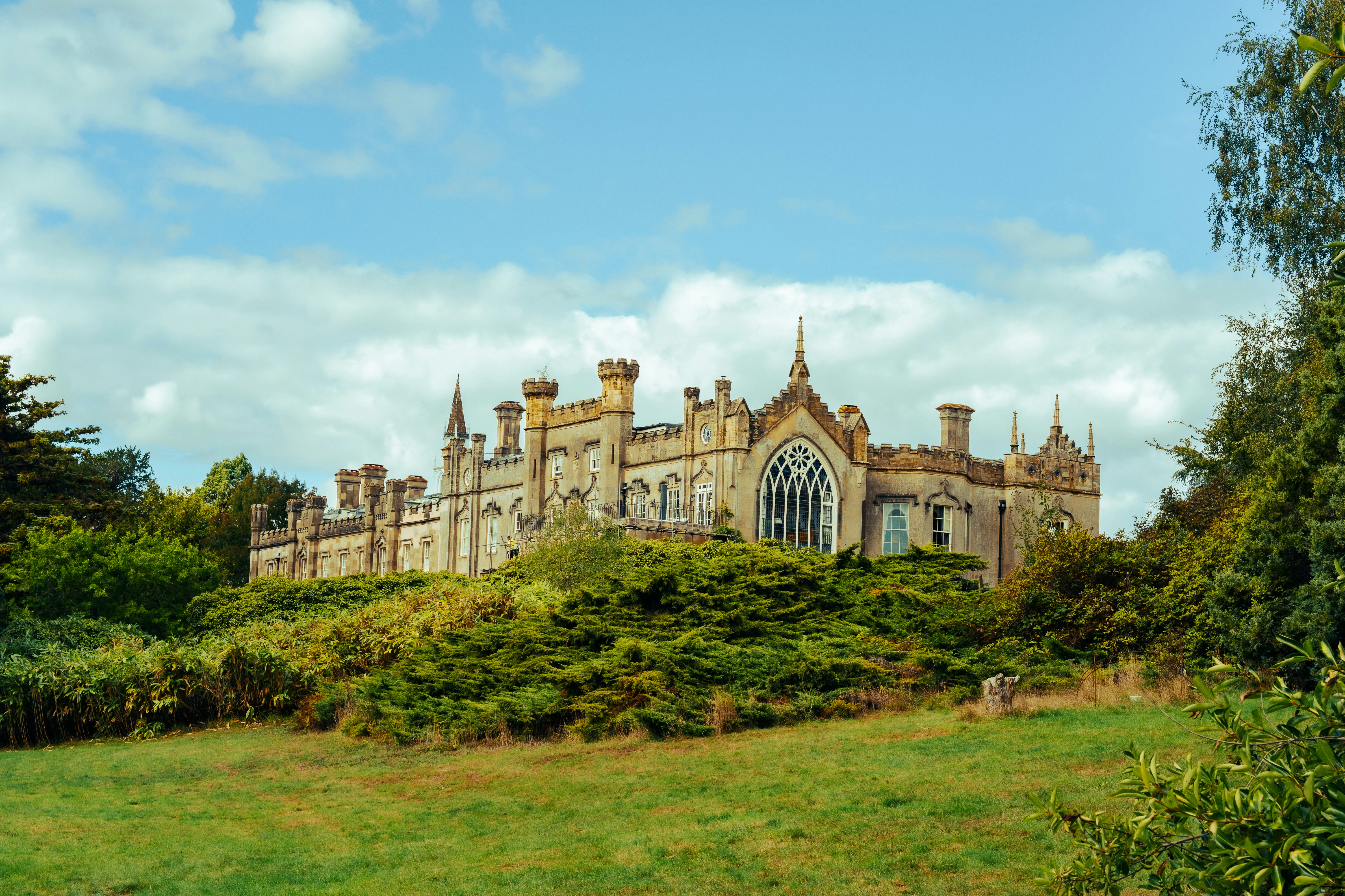 Heritage Crest: An English Castle Nestled in Emerald Grounds