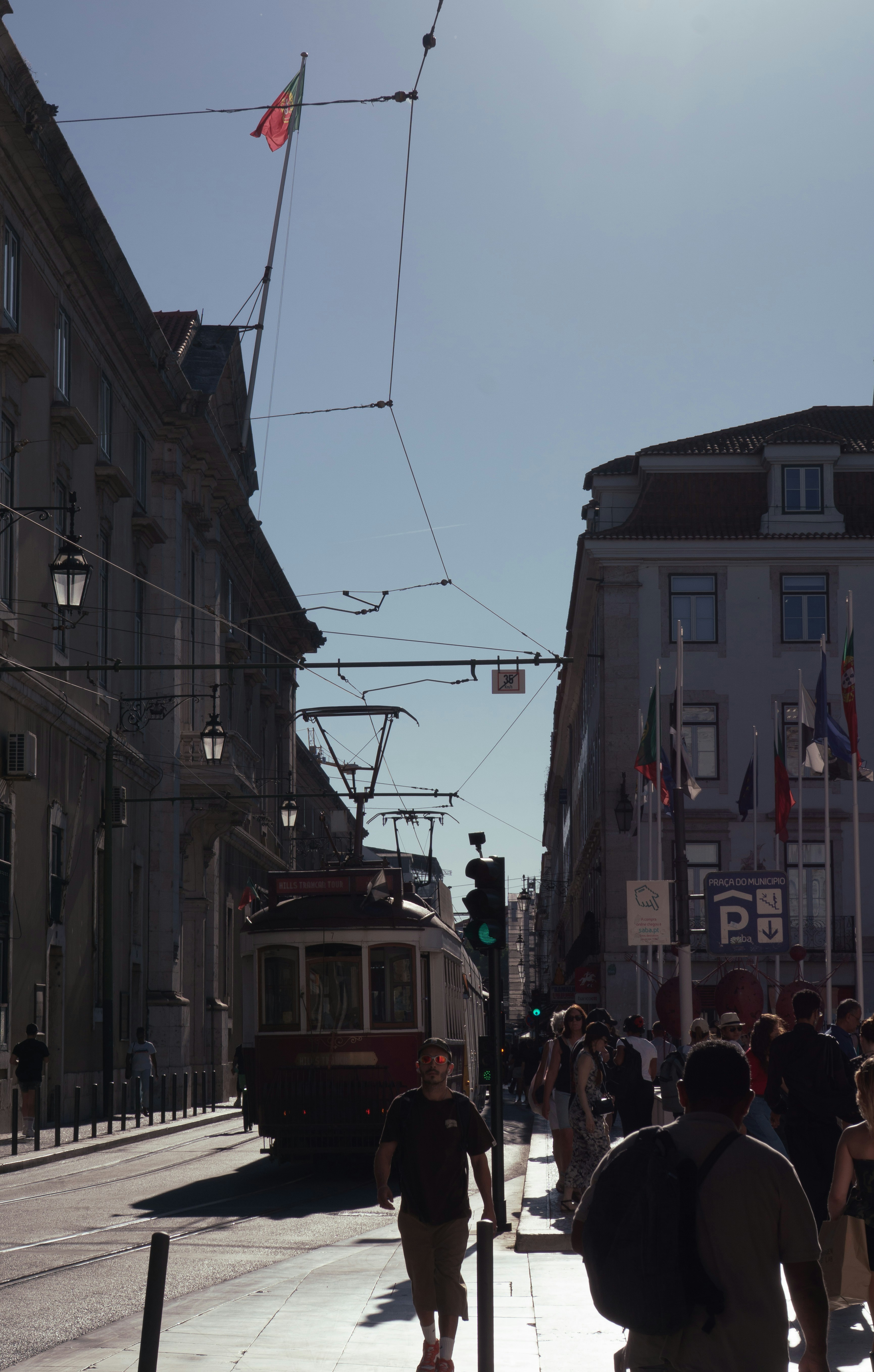Tramlines and Townscape: A Busy European Street Carves Light and Shadow