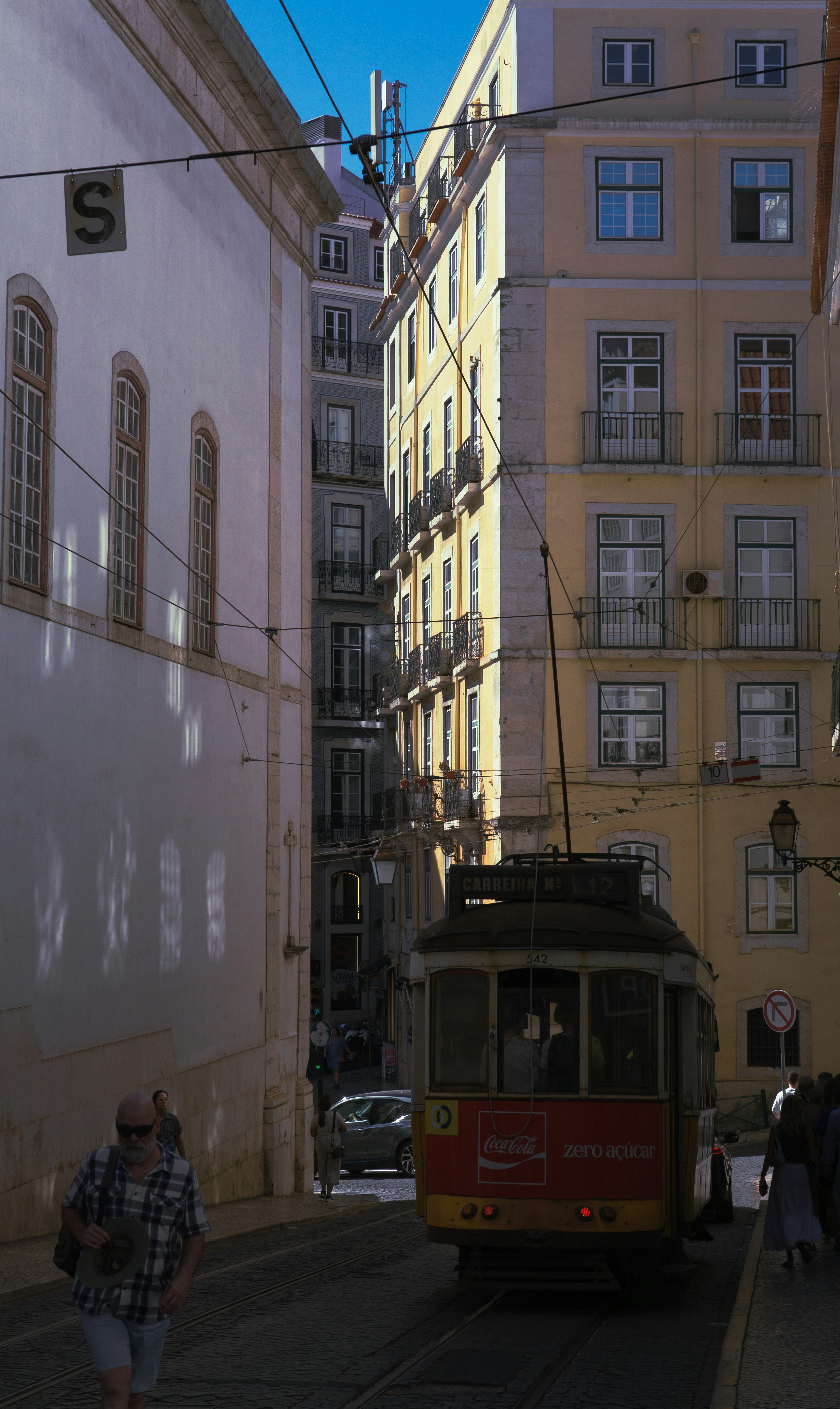 Tram in a Sunlit Lisbon Alley