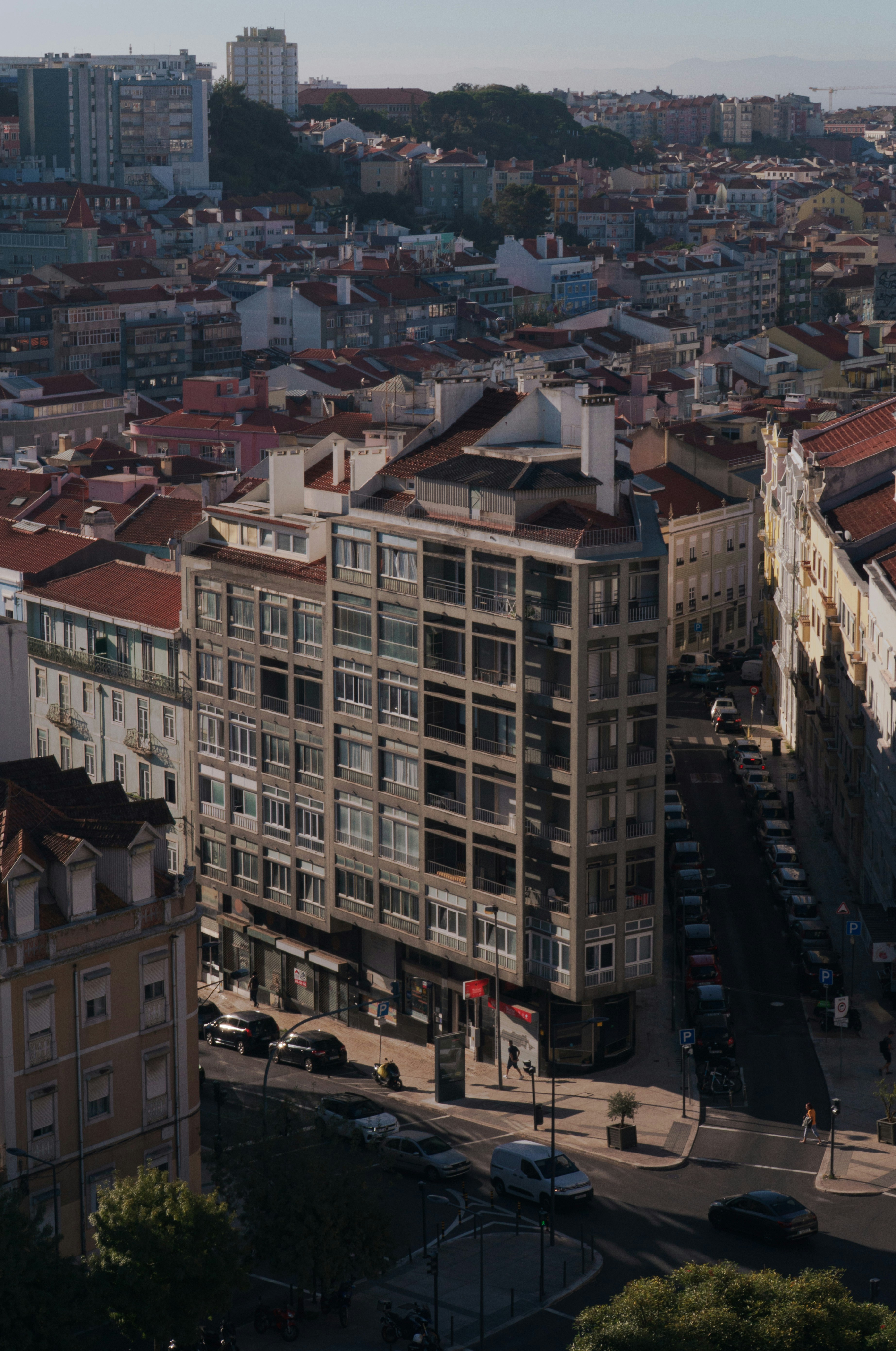 Edwardian Corner: A Streetcar of Shadows Beneath Red-Tiled Rooftops