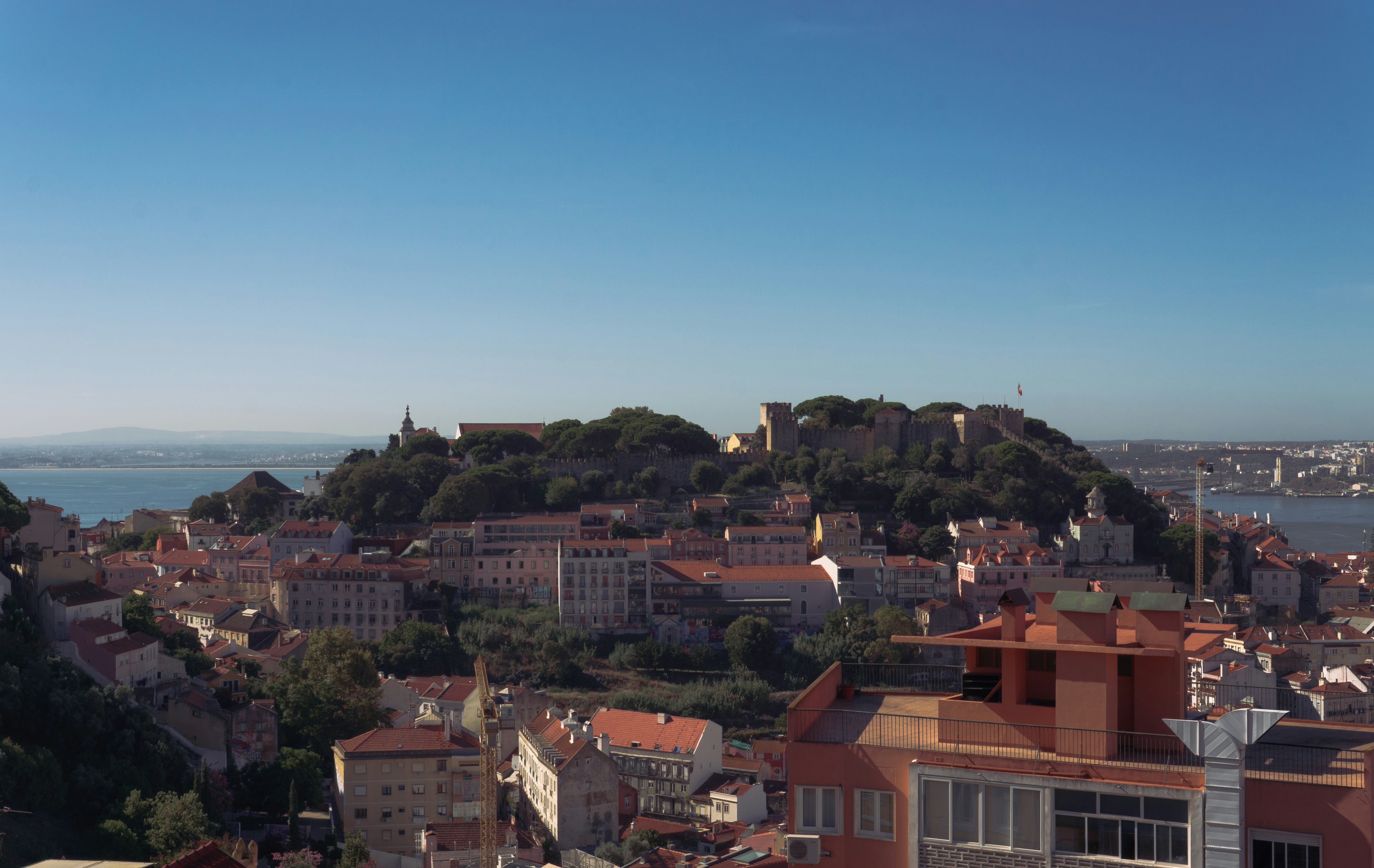 Hilltop Fortress Overlooking a Sunlit Coastal Town