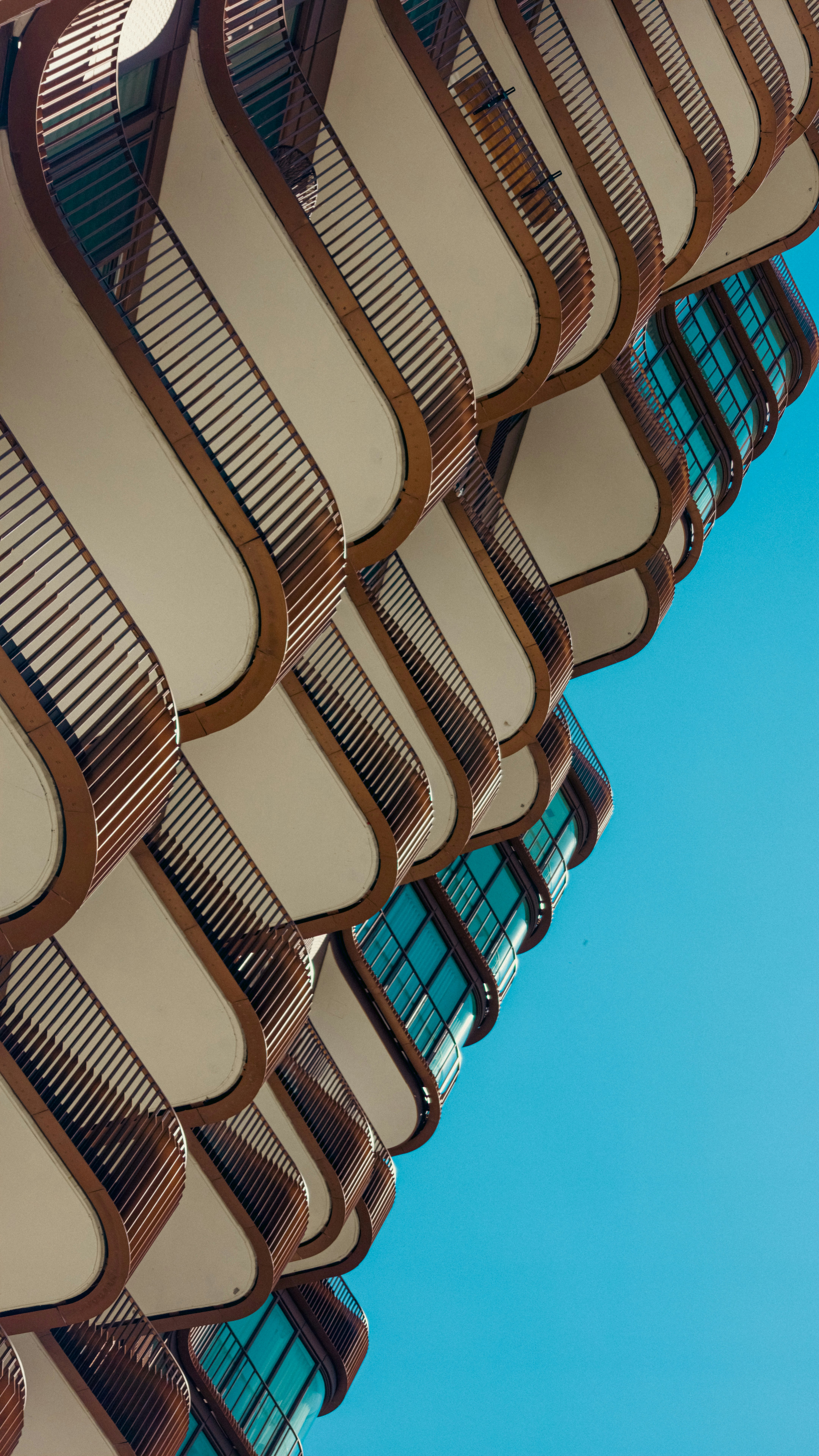 Curved Balconies Against a Sky of Teal