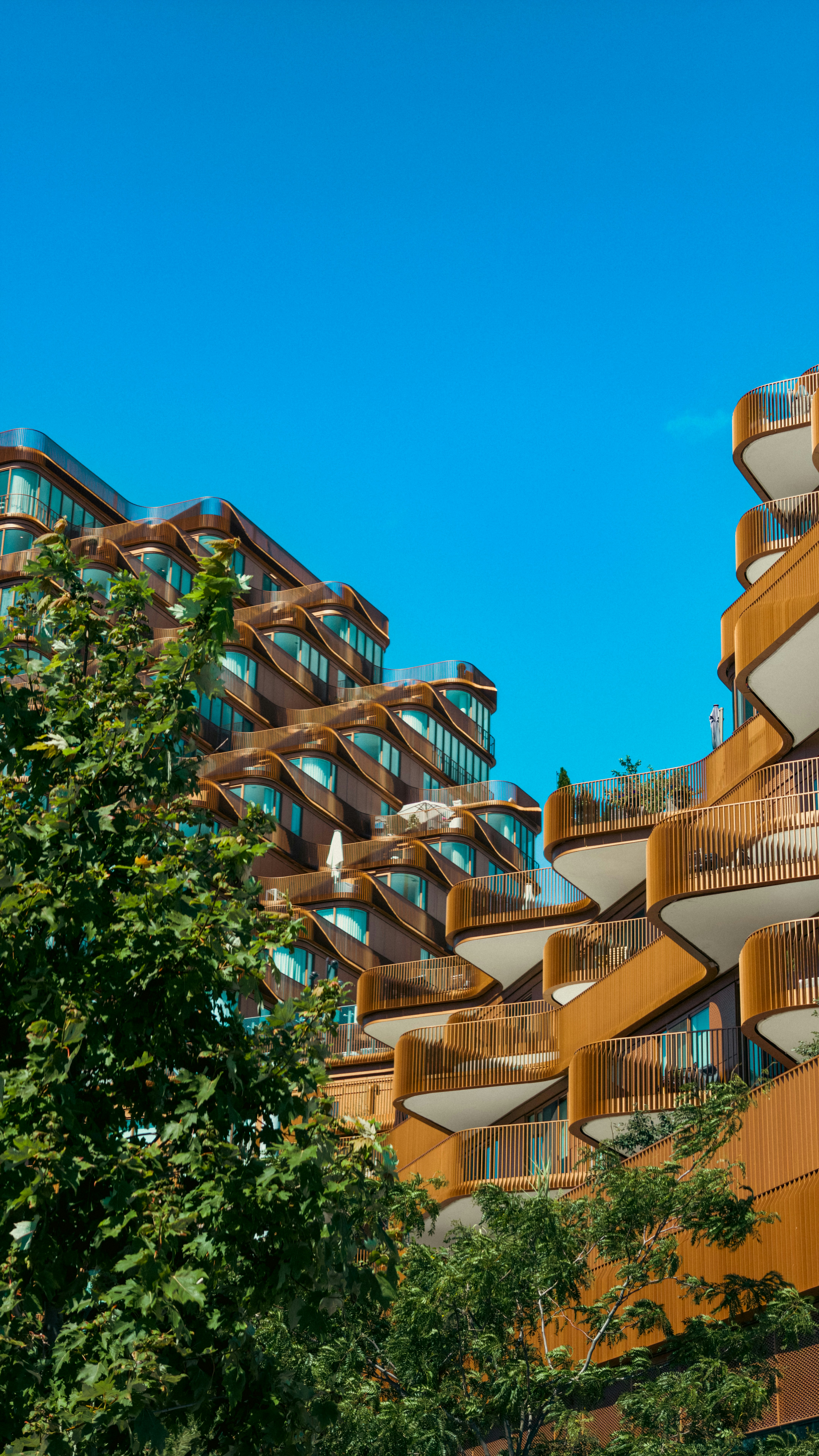 Urban Waves: Terrace Carousel Against a Cerulean Sky