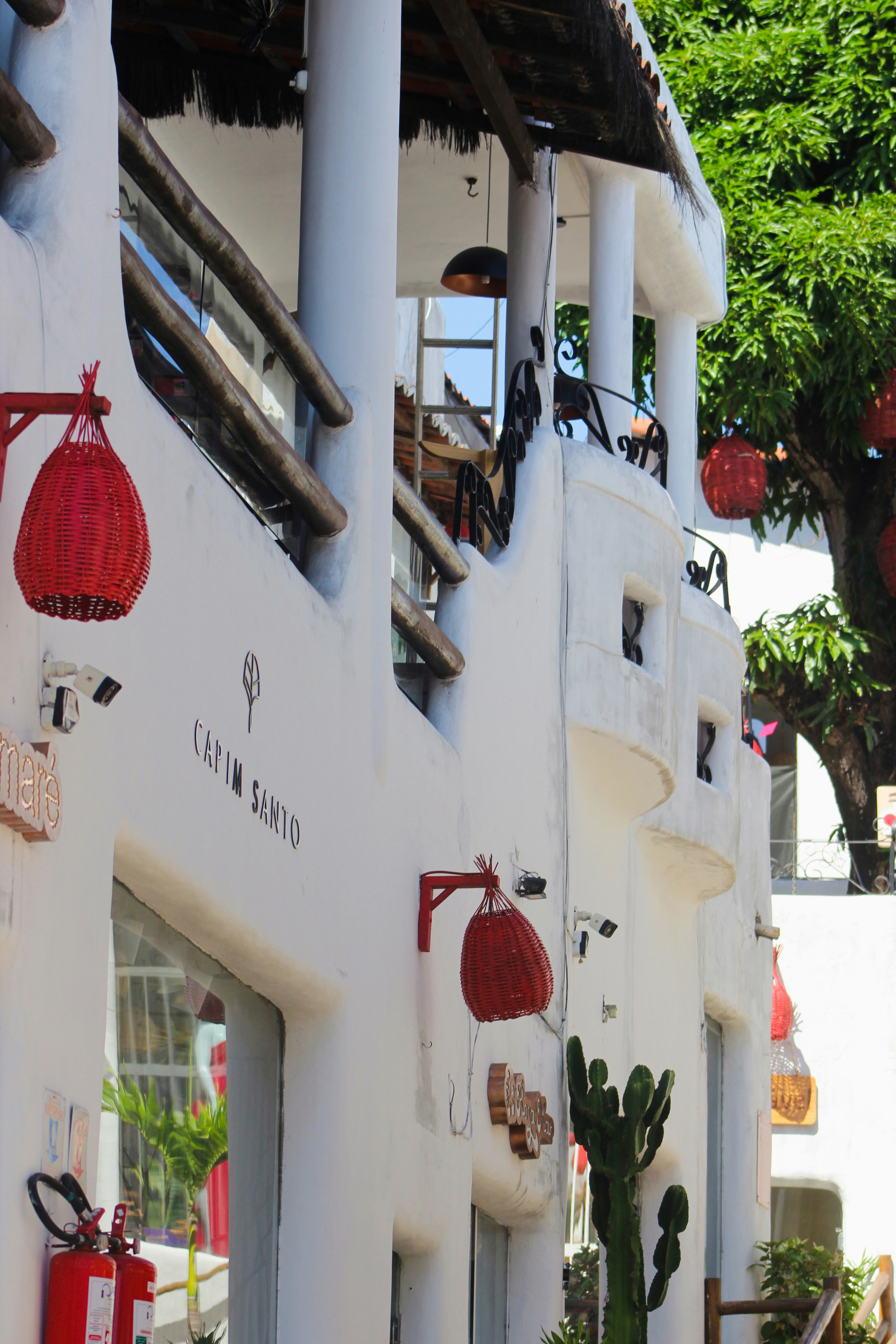 Whitewashed Courtyard of Lanterns and Arched Balconies
