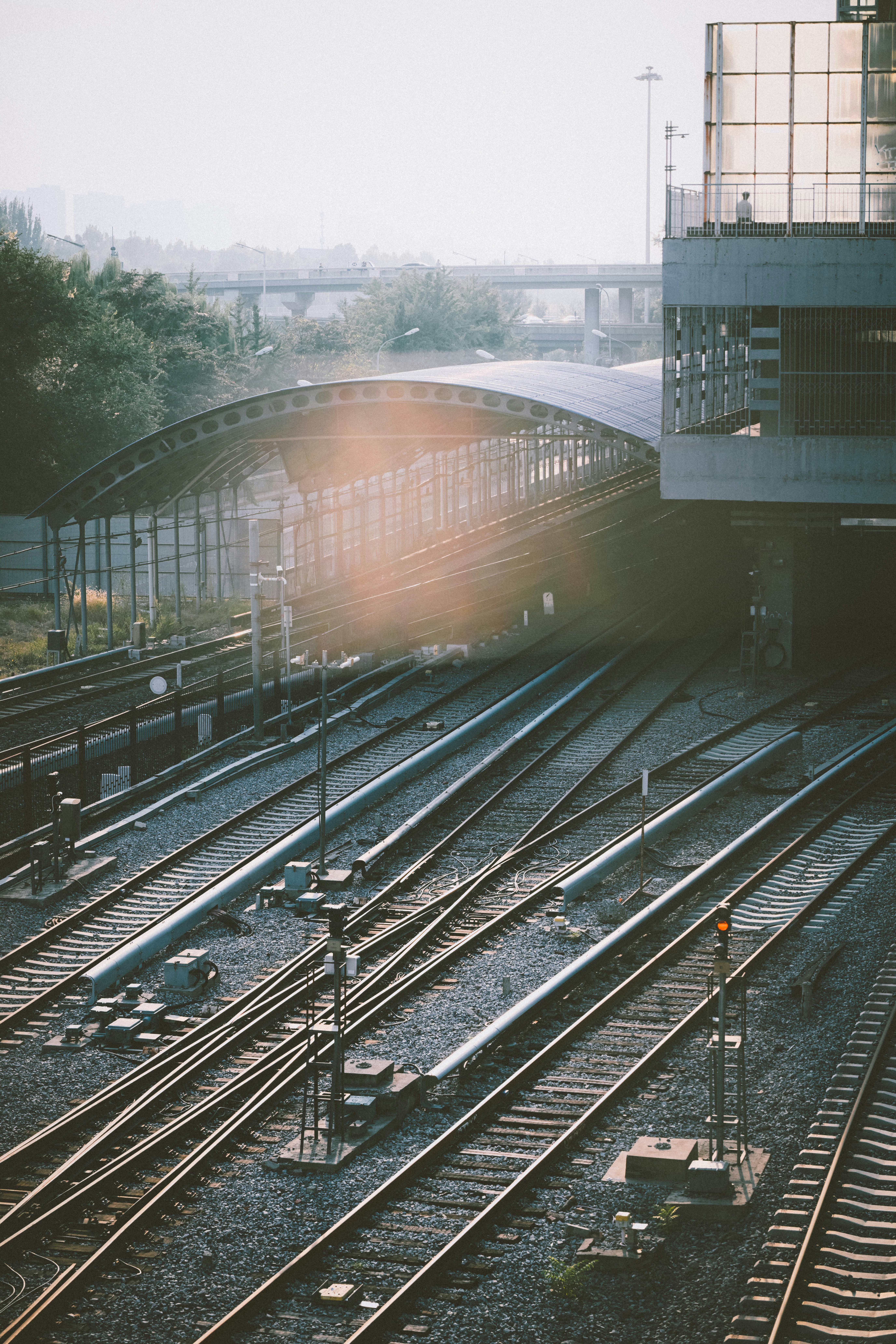 Sunlit Rail Corridor Through a Multifaceted Urban Station