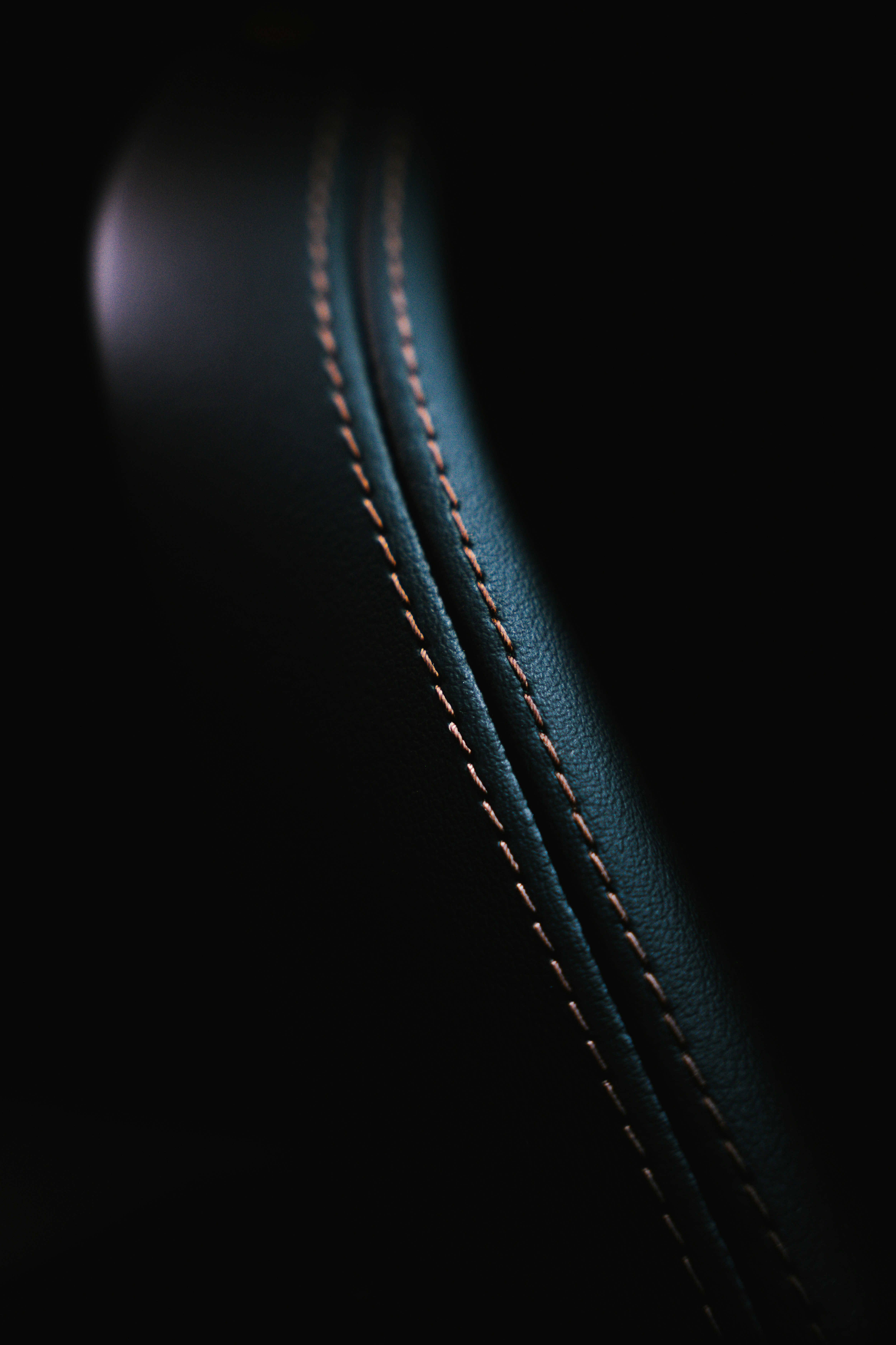 Stitched leather seam in quiet light