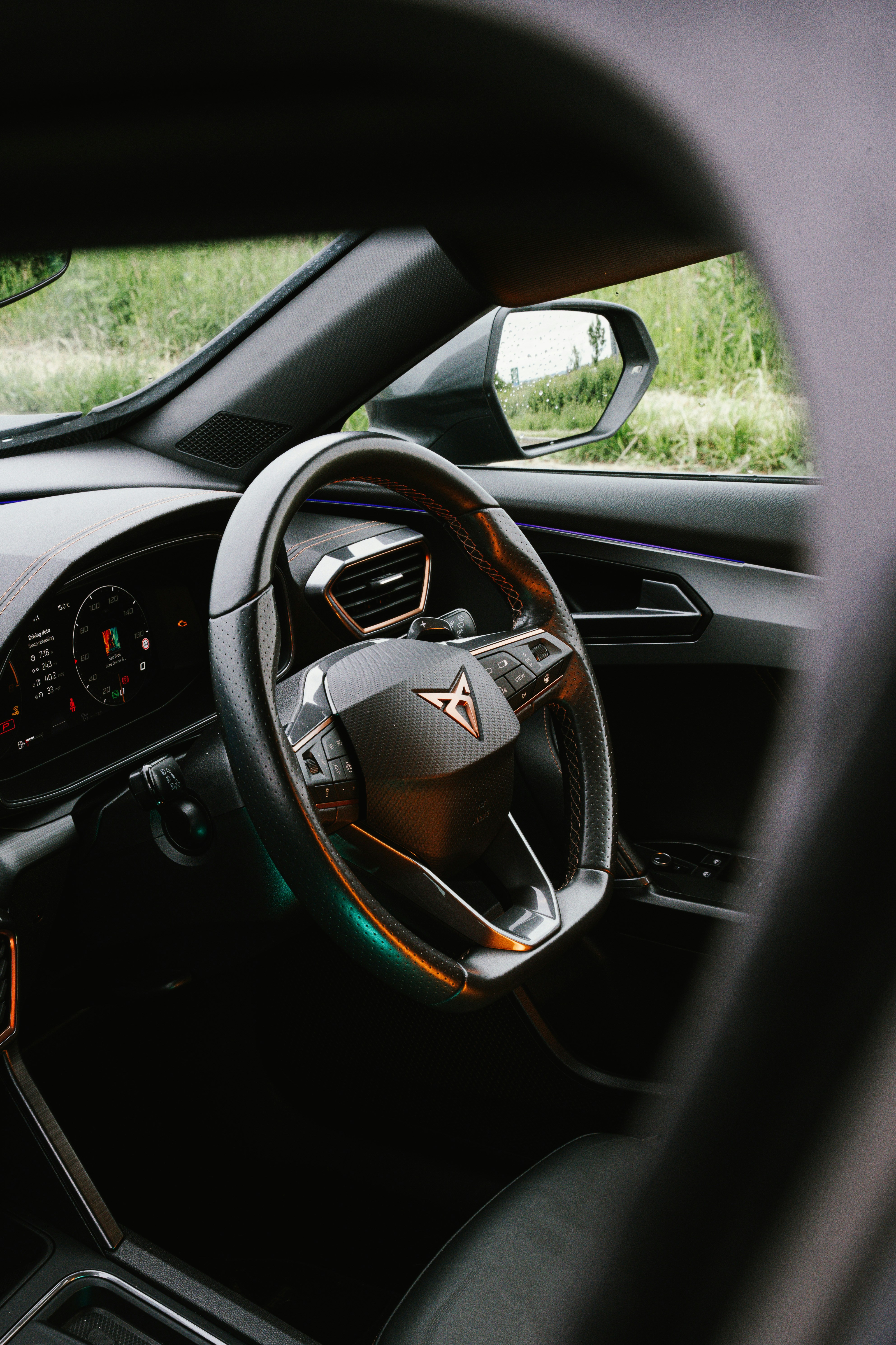 Steering Wheel Focus: A Modern Car Cabin in Soft Ambient Light