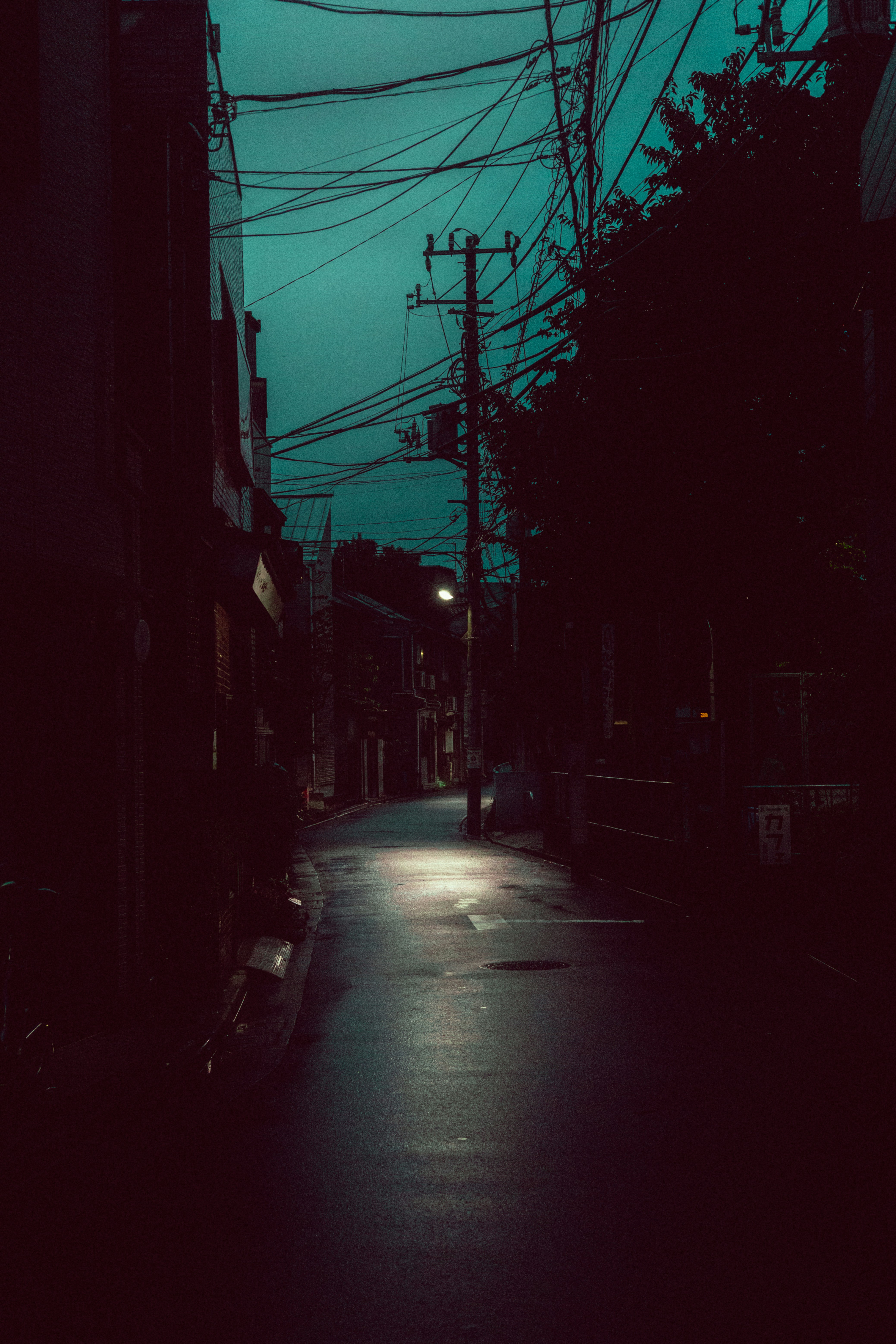  Neon-lit Alleyway: Quiet Street Under Turquoise Night