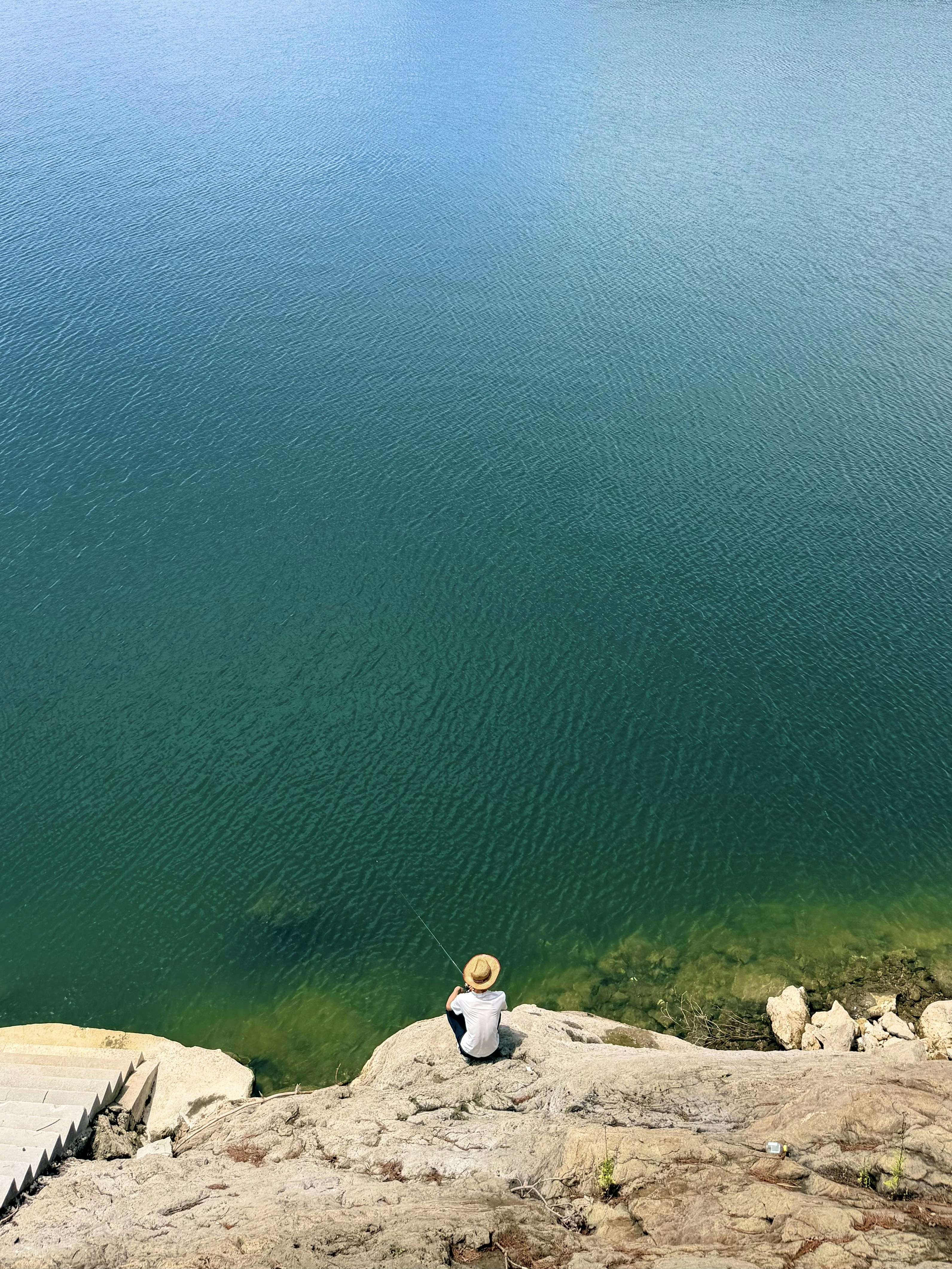 Quiet Angler at the Water’s Edge
