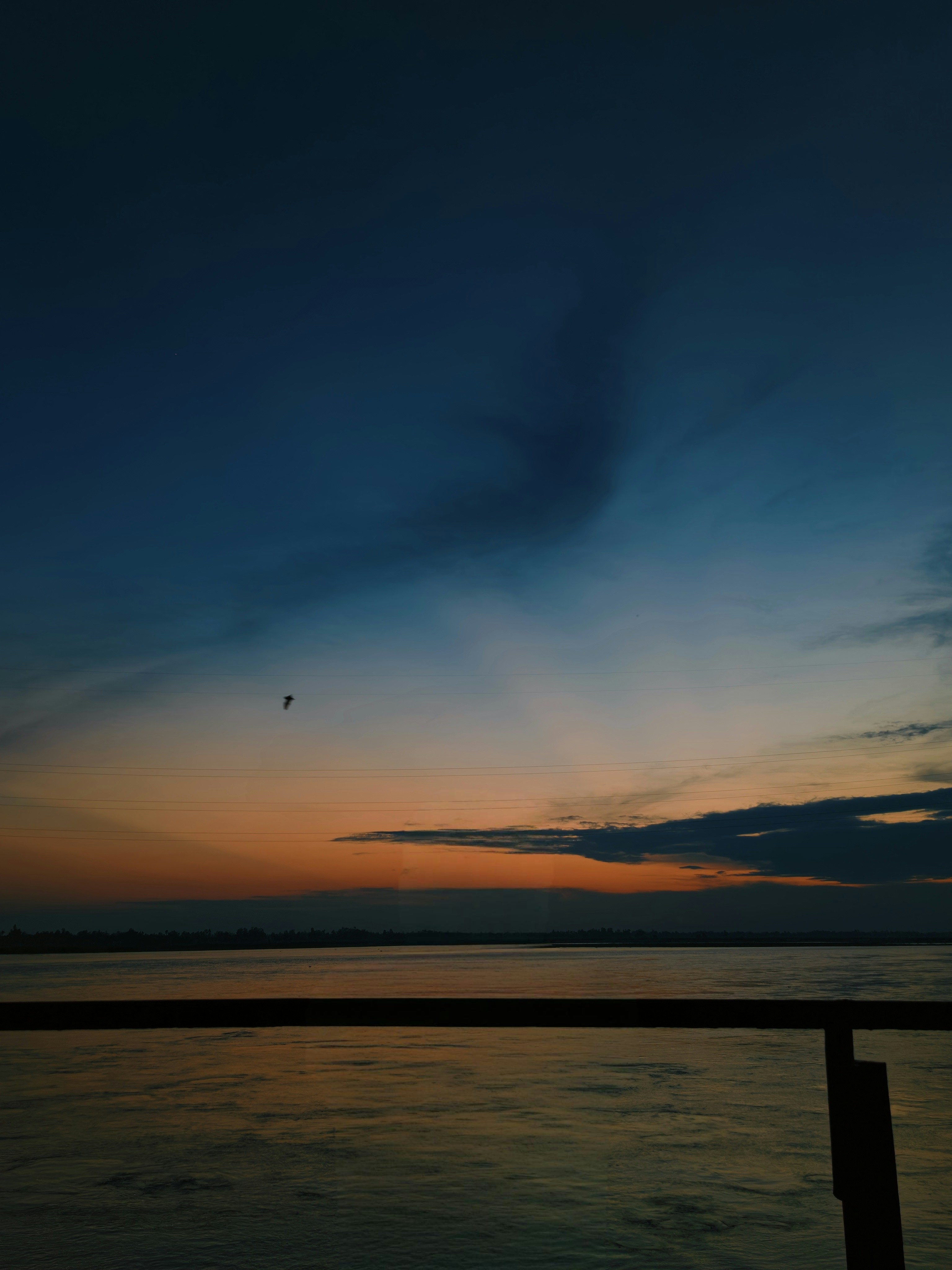 Horizon Glow Over Quiet Waters at Dusk