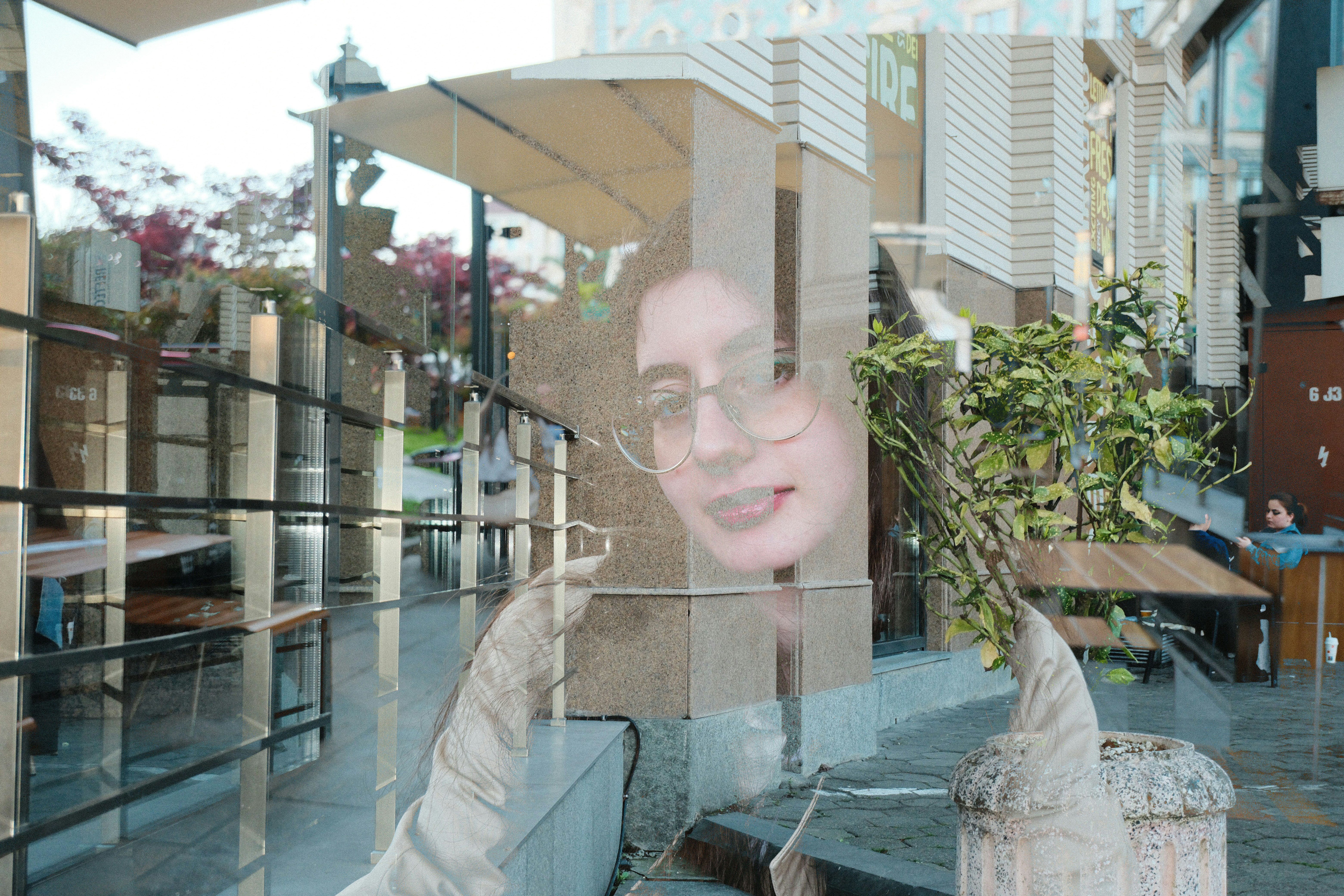 Reflected Portrait in a Glassy Urban Slice