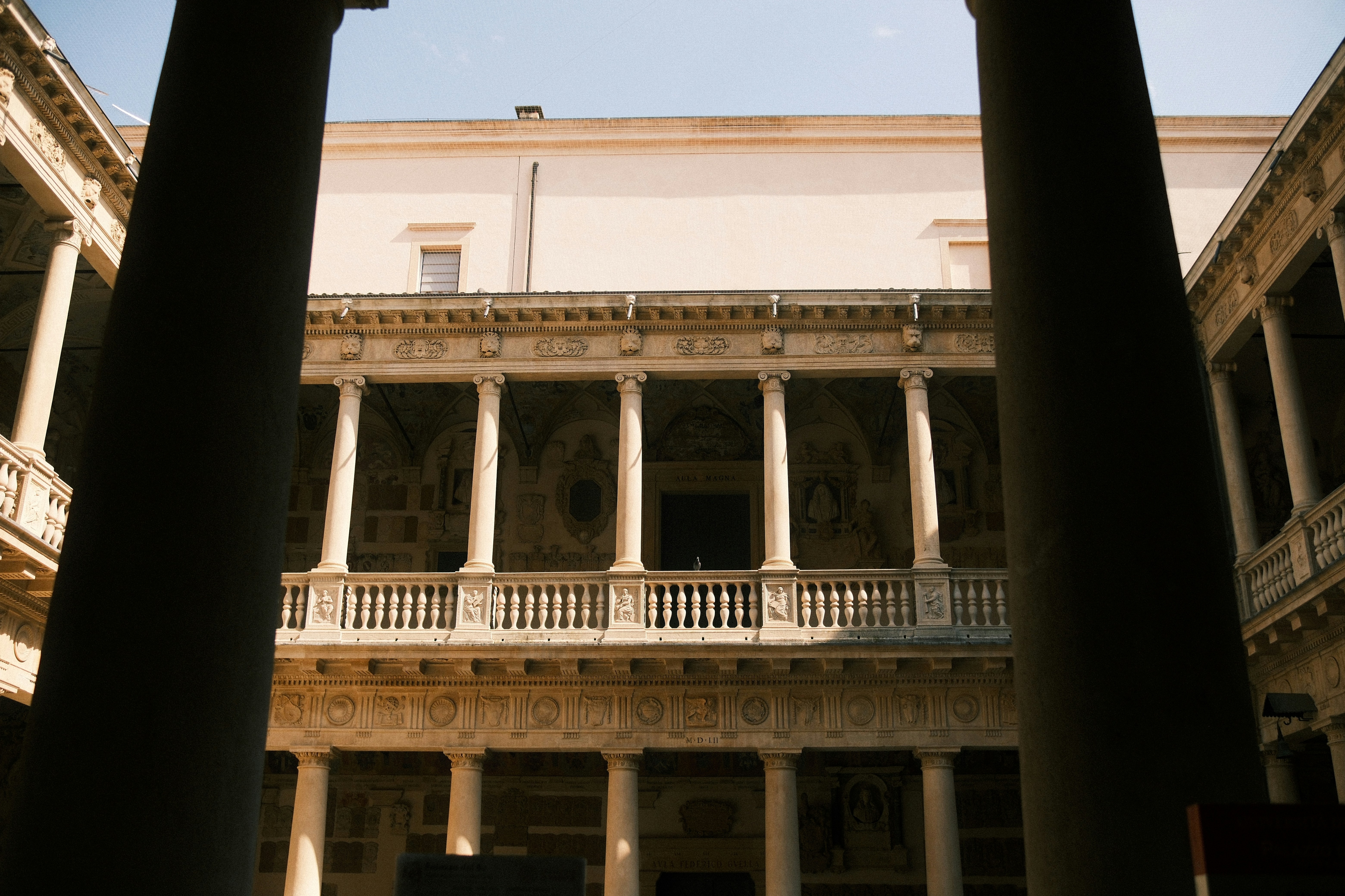 Colonial Courtyard in Shadows: A Classic Arcade of Columns